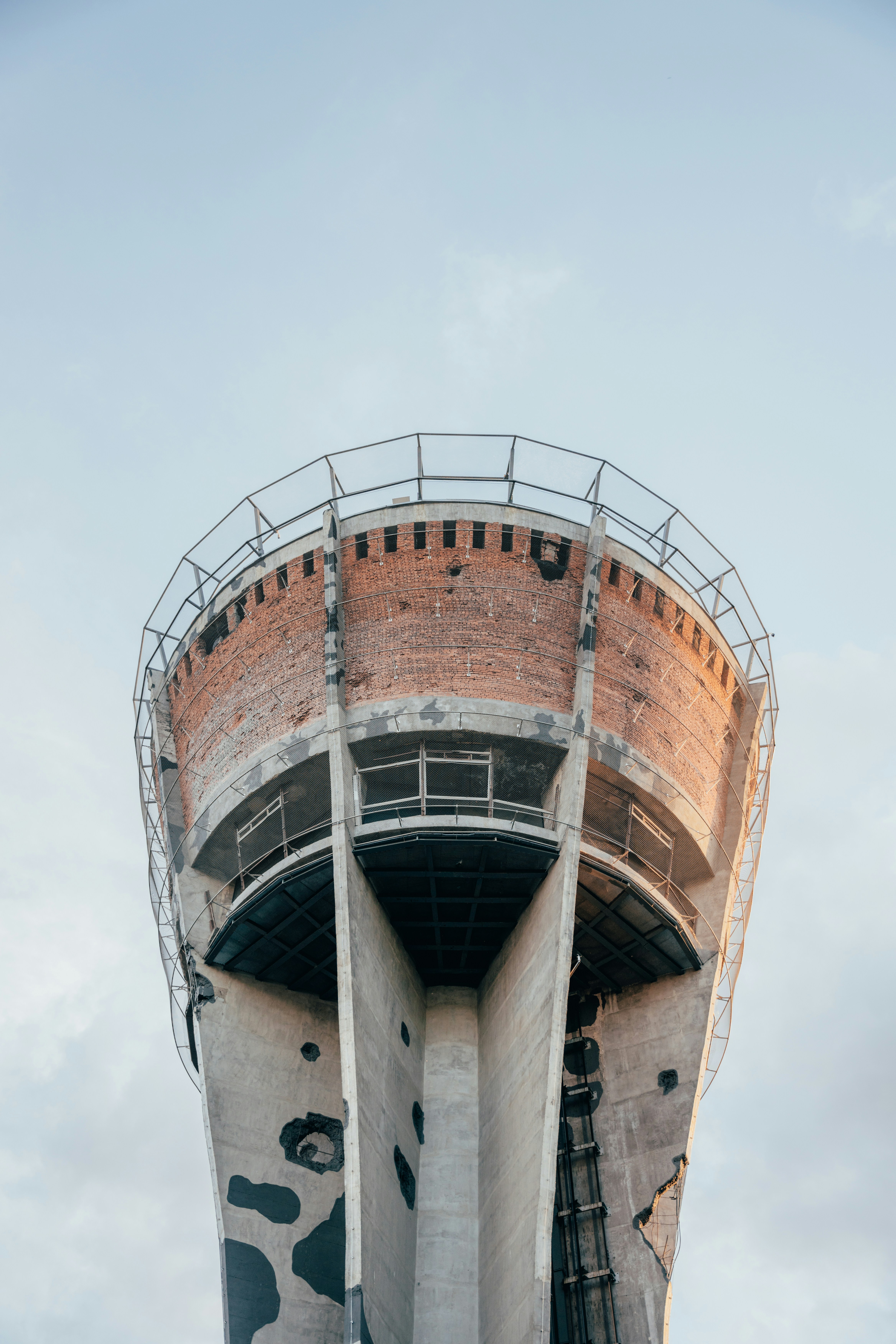 Brick Crowned by Steel: A Water Tower Reaching Skyward