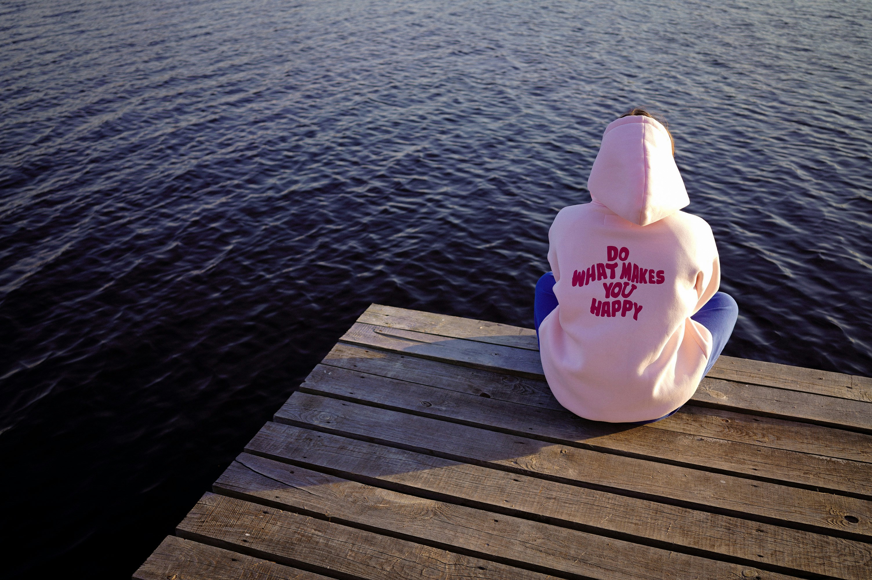 Do What Makes You Happy: Hooded Figure at the Edge of the Dock