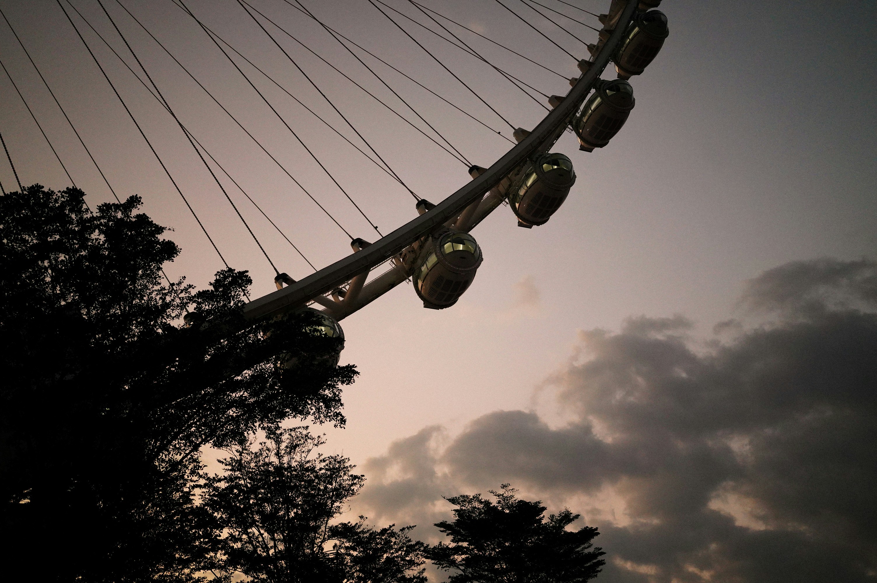 Edge of the Sky: Ferris Wheel Silhouette Against Dusk