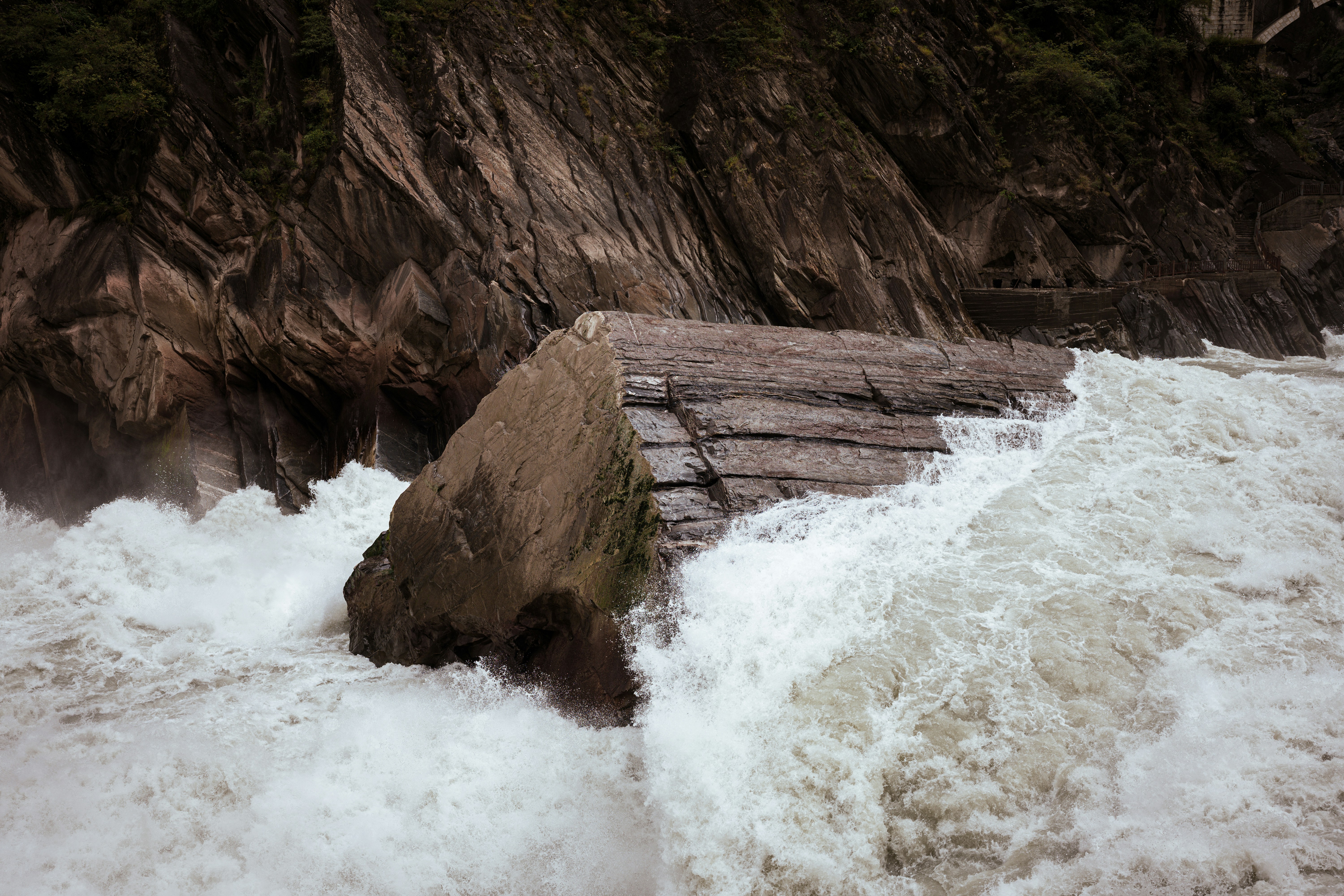 A large rock in the middle of a body of water photo – Free Shangri-la ...