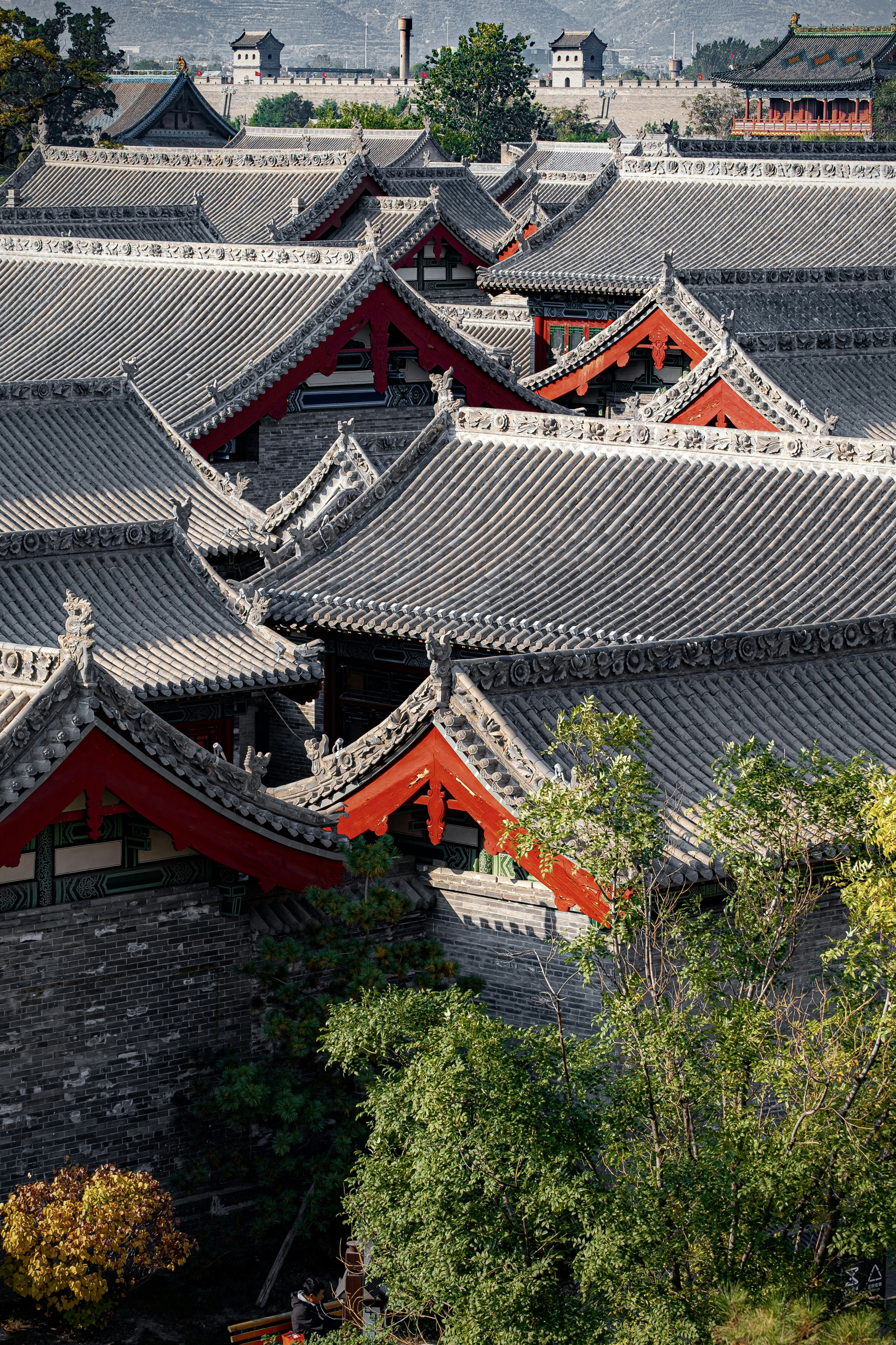 A view of a chinese building with a mountain in the background photo ...