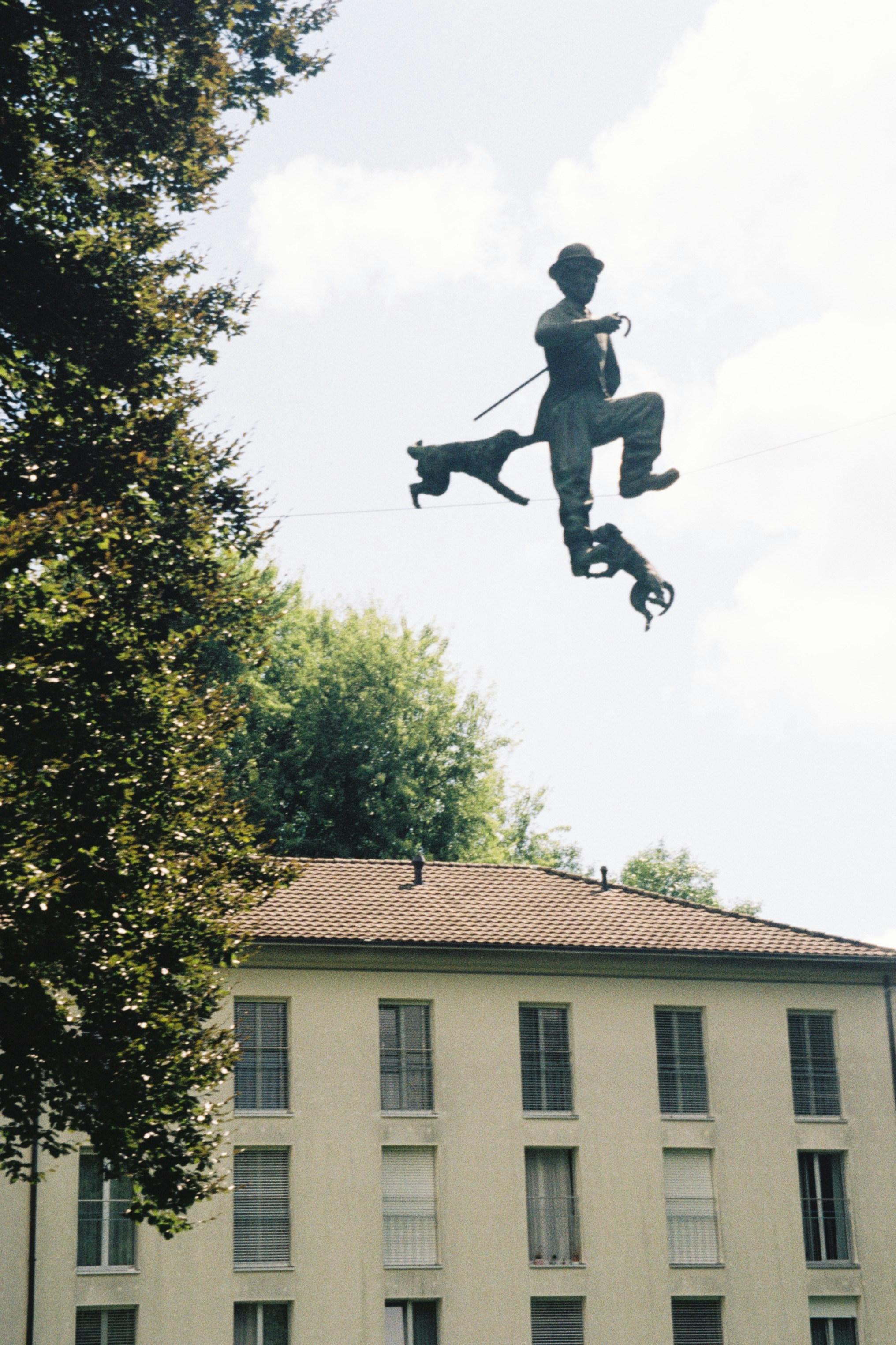 High Wire Icon: A Metal Figure Walks the Skyline