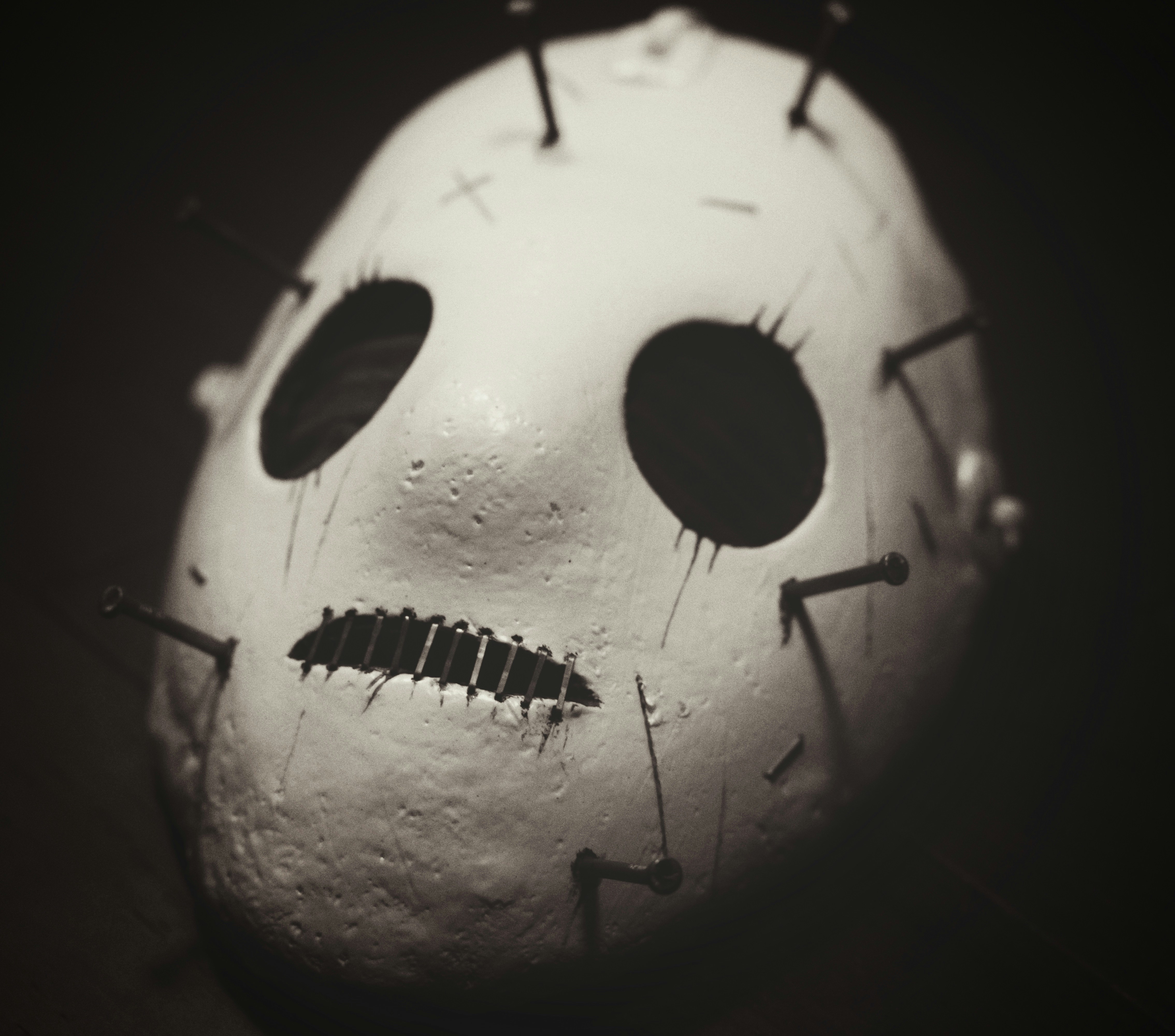 A white mask with pins sticking out of it photo – Free Mask Image on ...