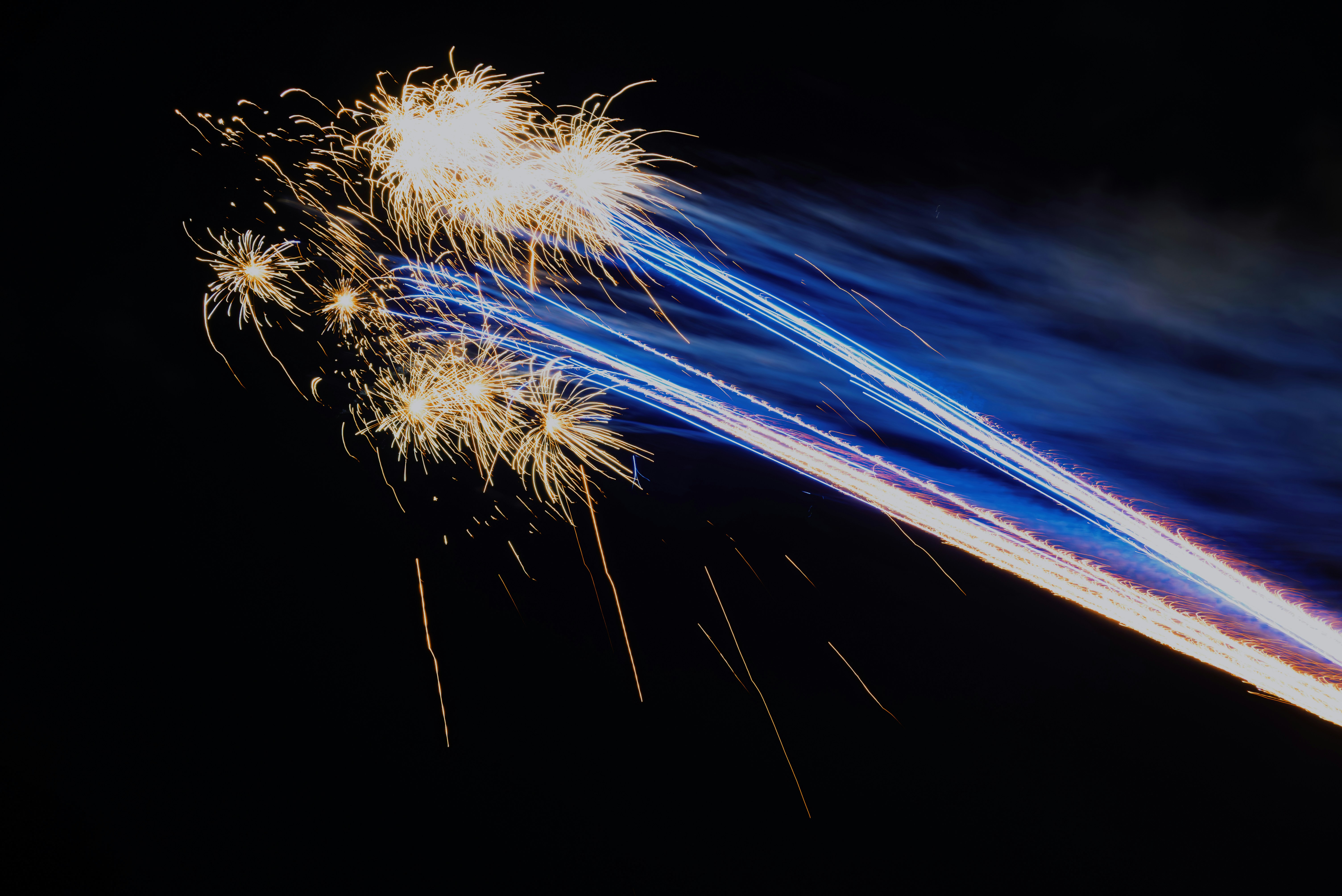 A blue and white firework in the night sky photo – Free Fireworks Image ...