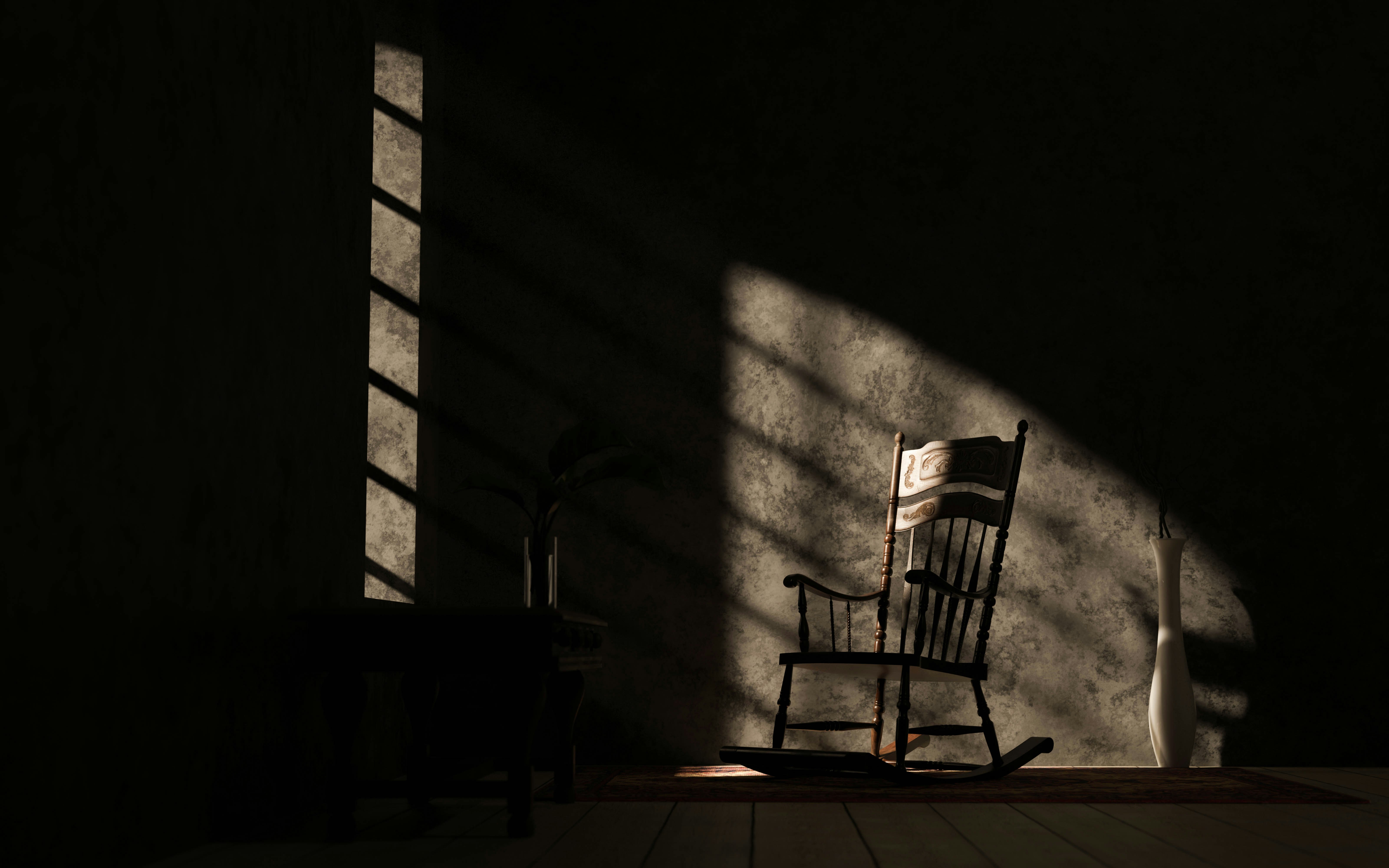 A rocking chair sitting in a dark room photo – Free 3d Image on Unsplash