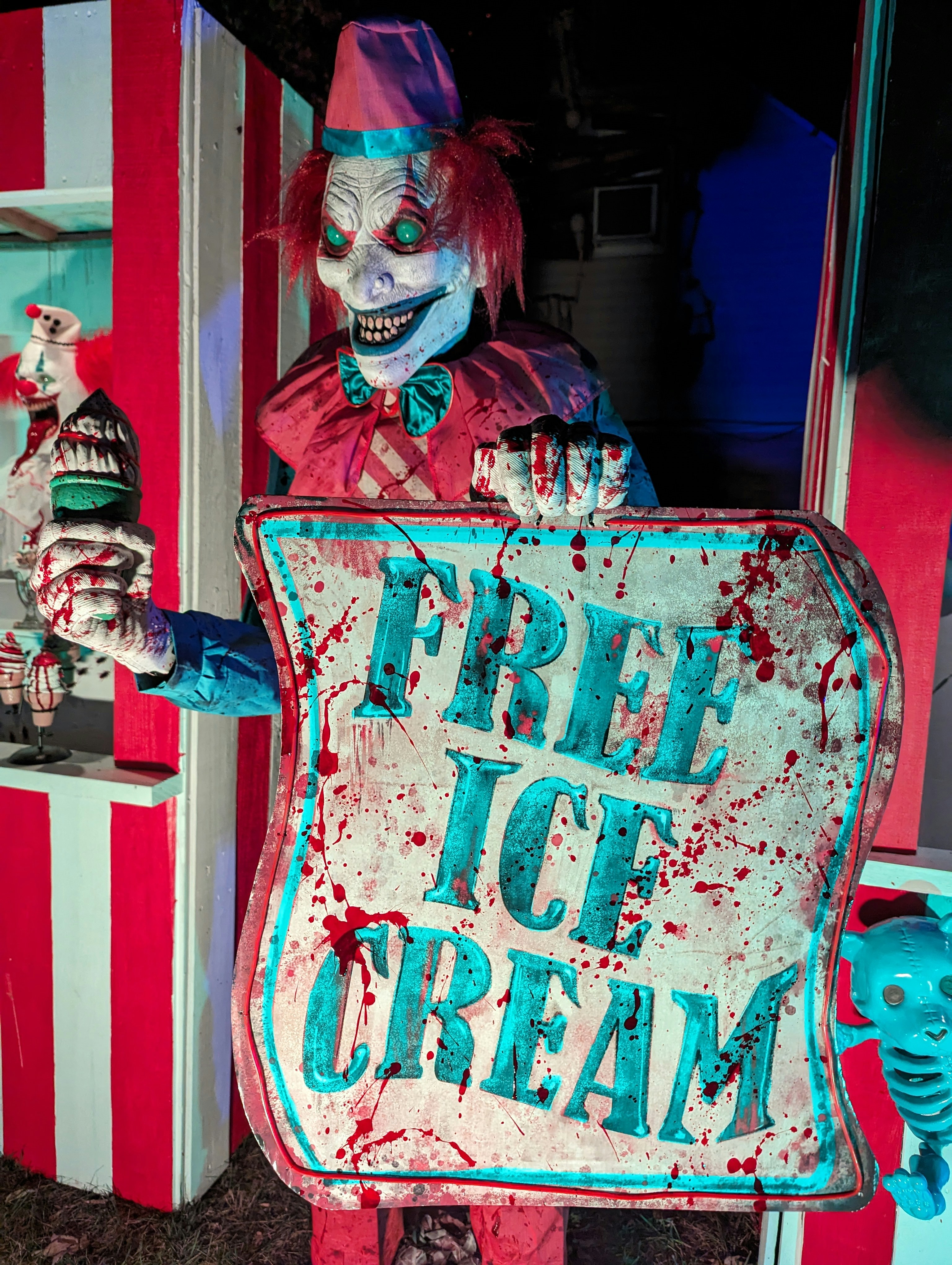 A creepy clown holding a free ice cream sign photo – Free Halloween ...