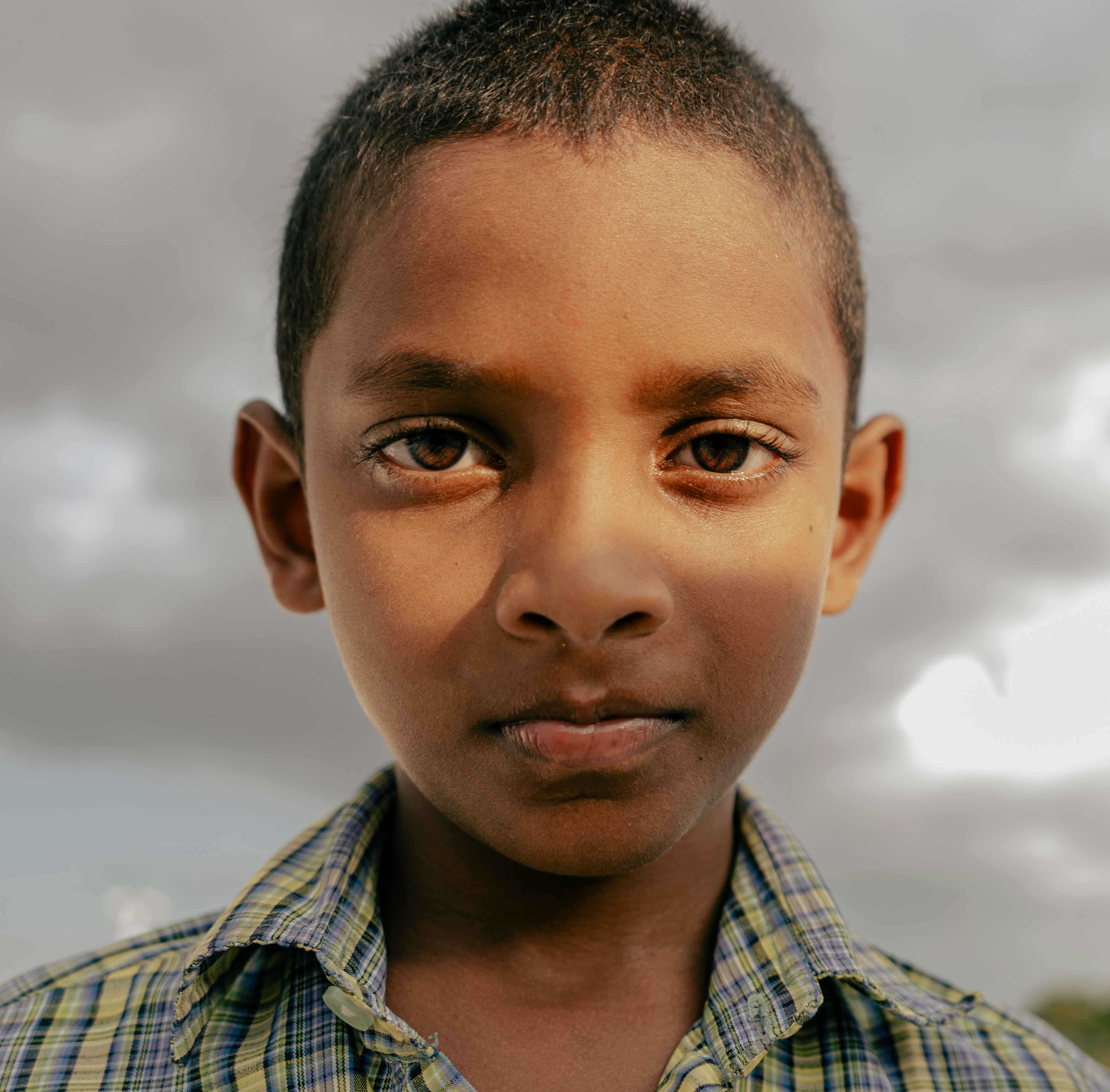 A close up of a person wearing a plaid shirt photo – Free Portrait ...