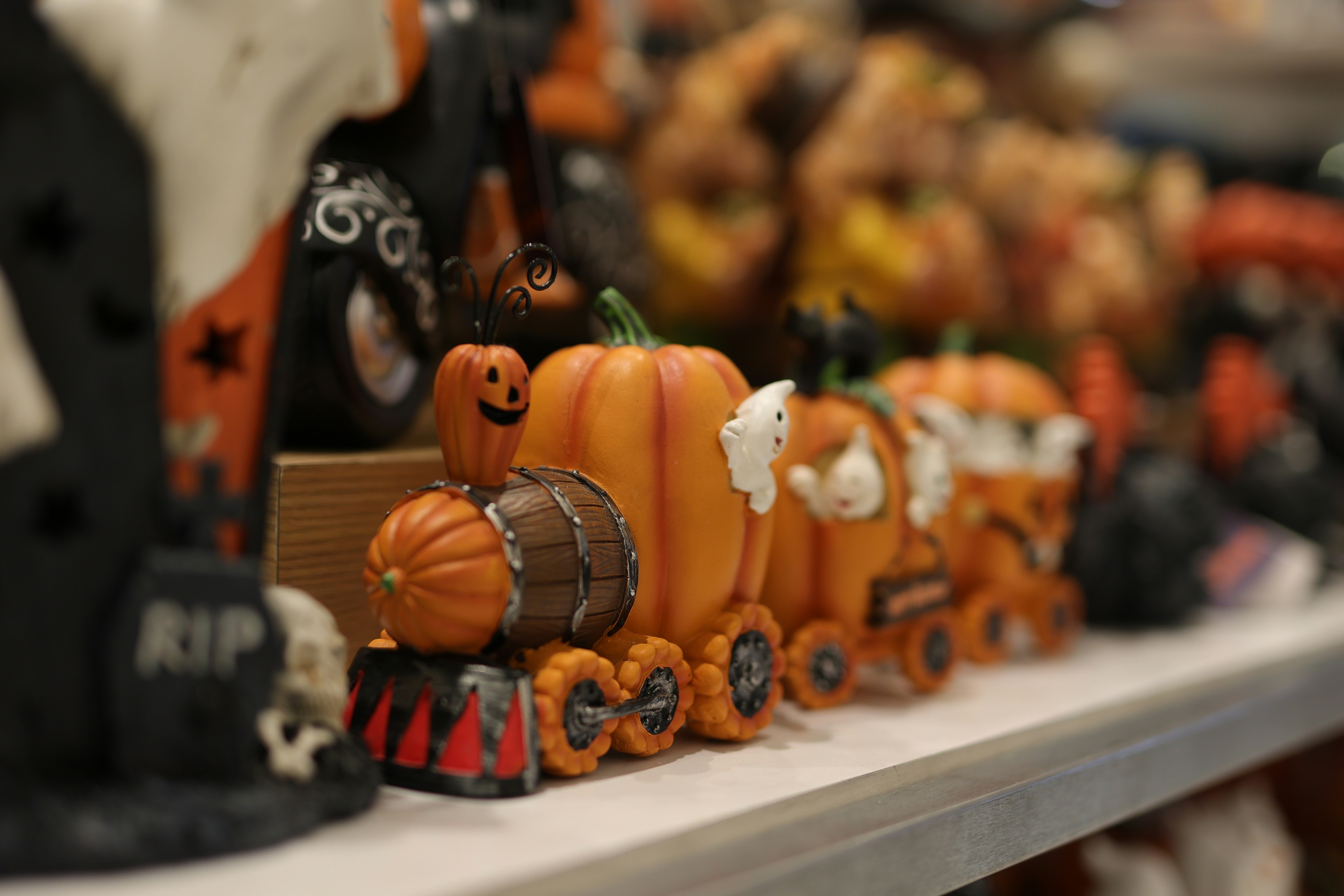 Halloween Display on a Shelf: Mini Pumpkin Parade in Warm Lighting