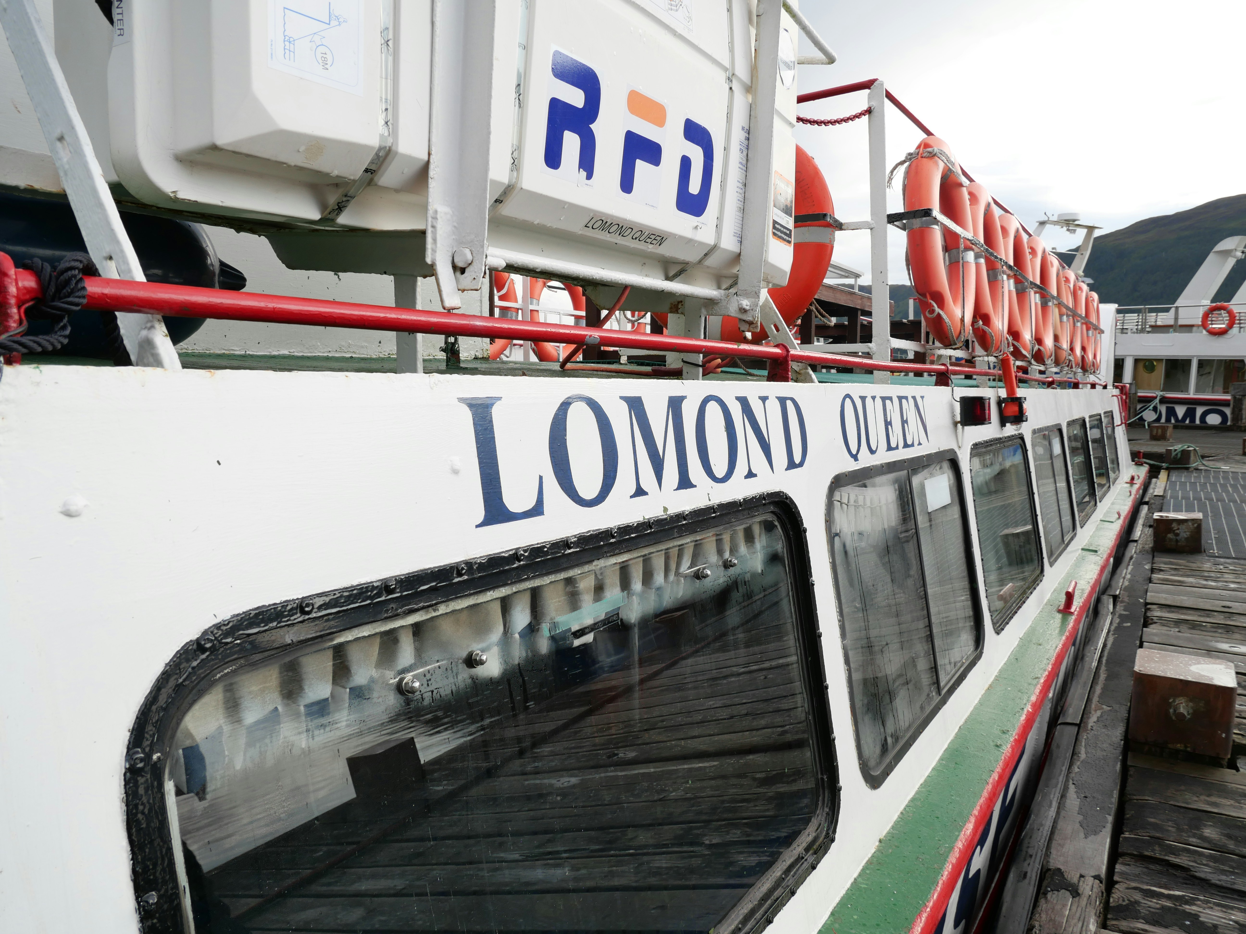 Lomond Queen: Red Lifebuoys on a Coastal Transit Vessel