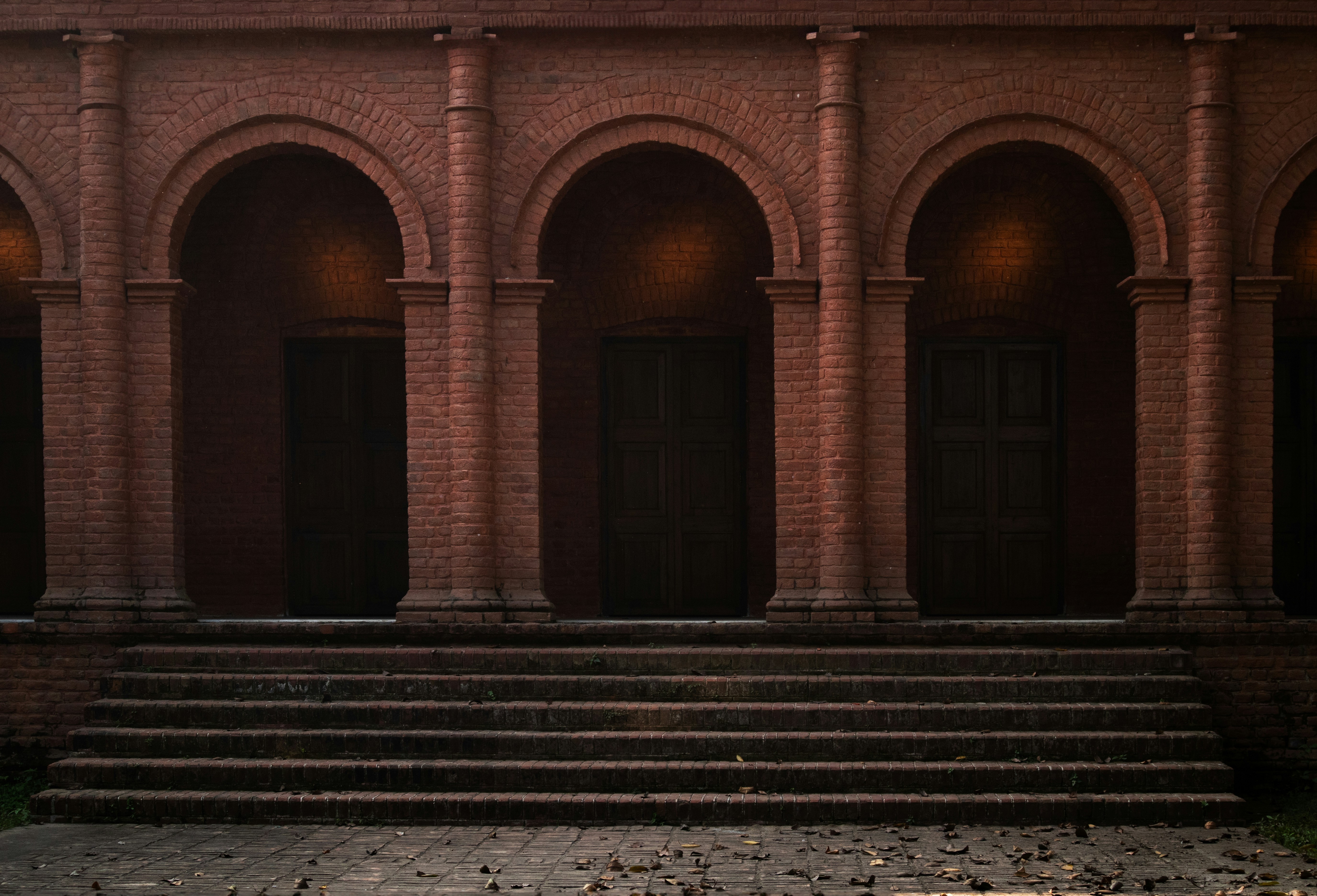 A brick building with a bunch of steps leading up to it photo – Free ...