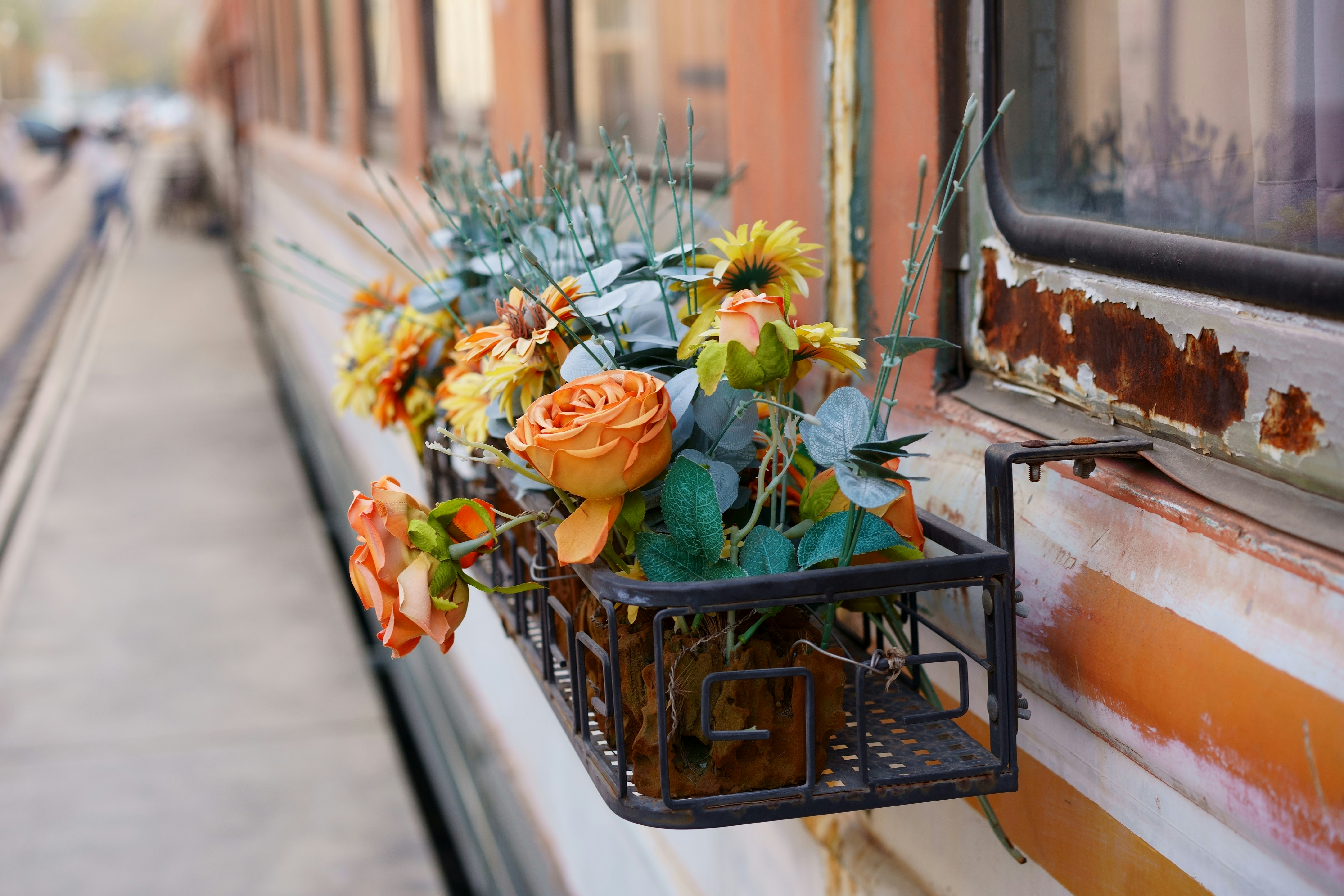 A window sill with a basket of flowers on it photo – Free Flower Image ...