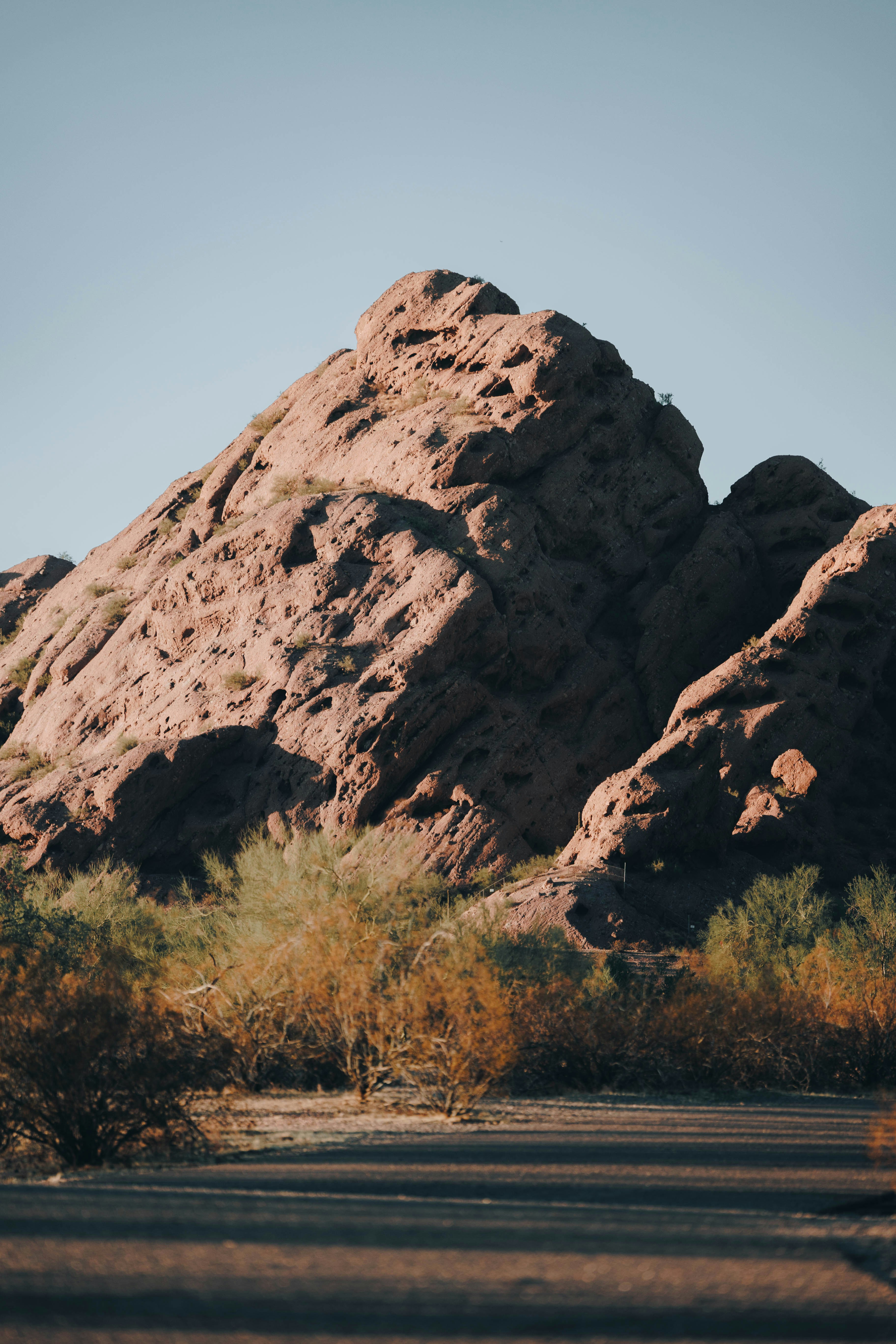A large rock formation in the middle of a desert photo – Free Road ...