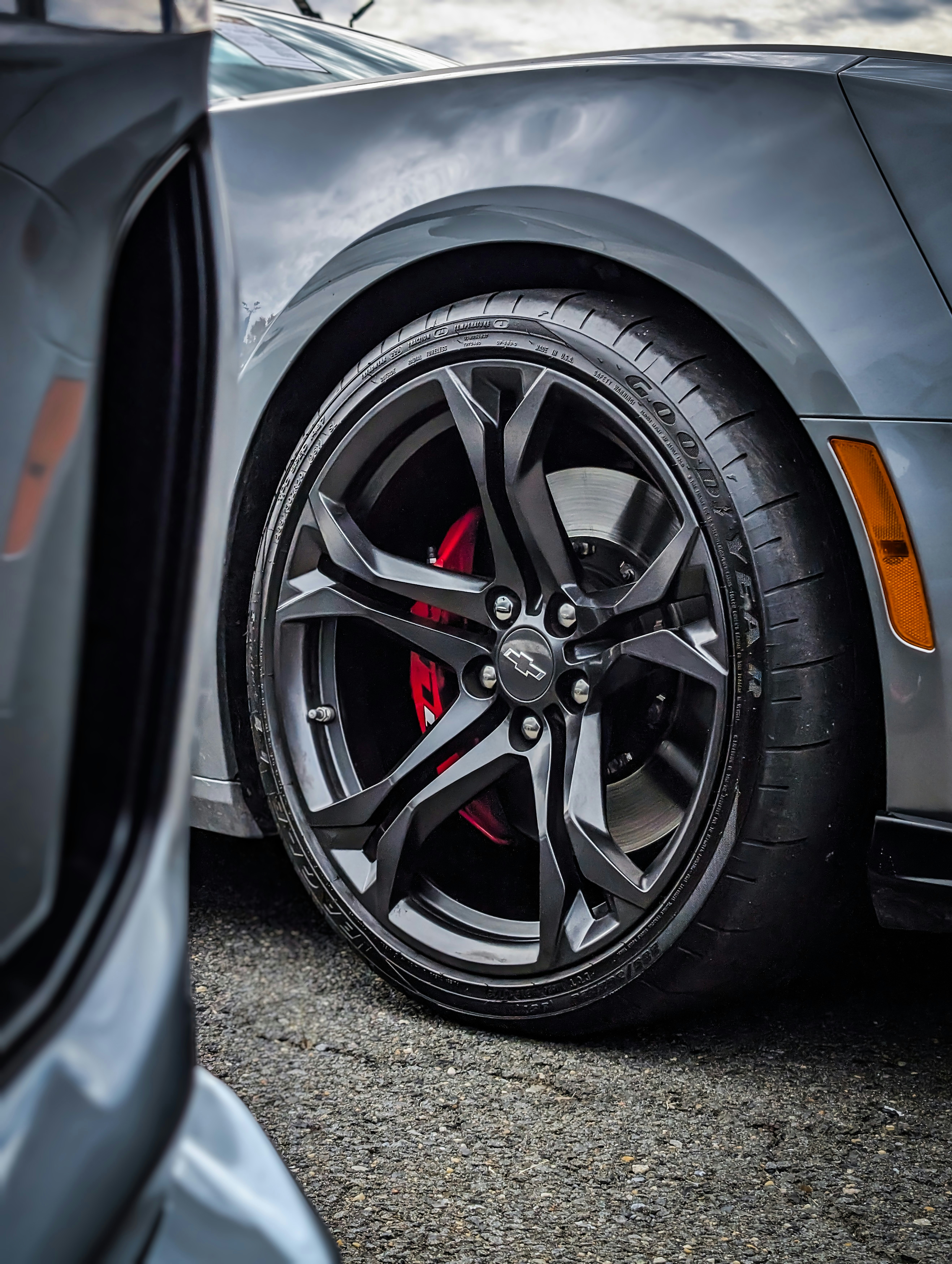 A close up of a car tire on a road photo – Free Alloy wheel Image on ...