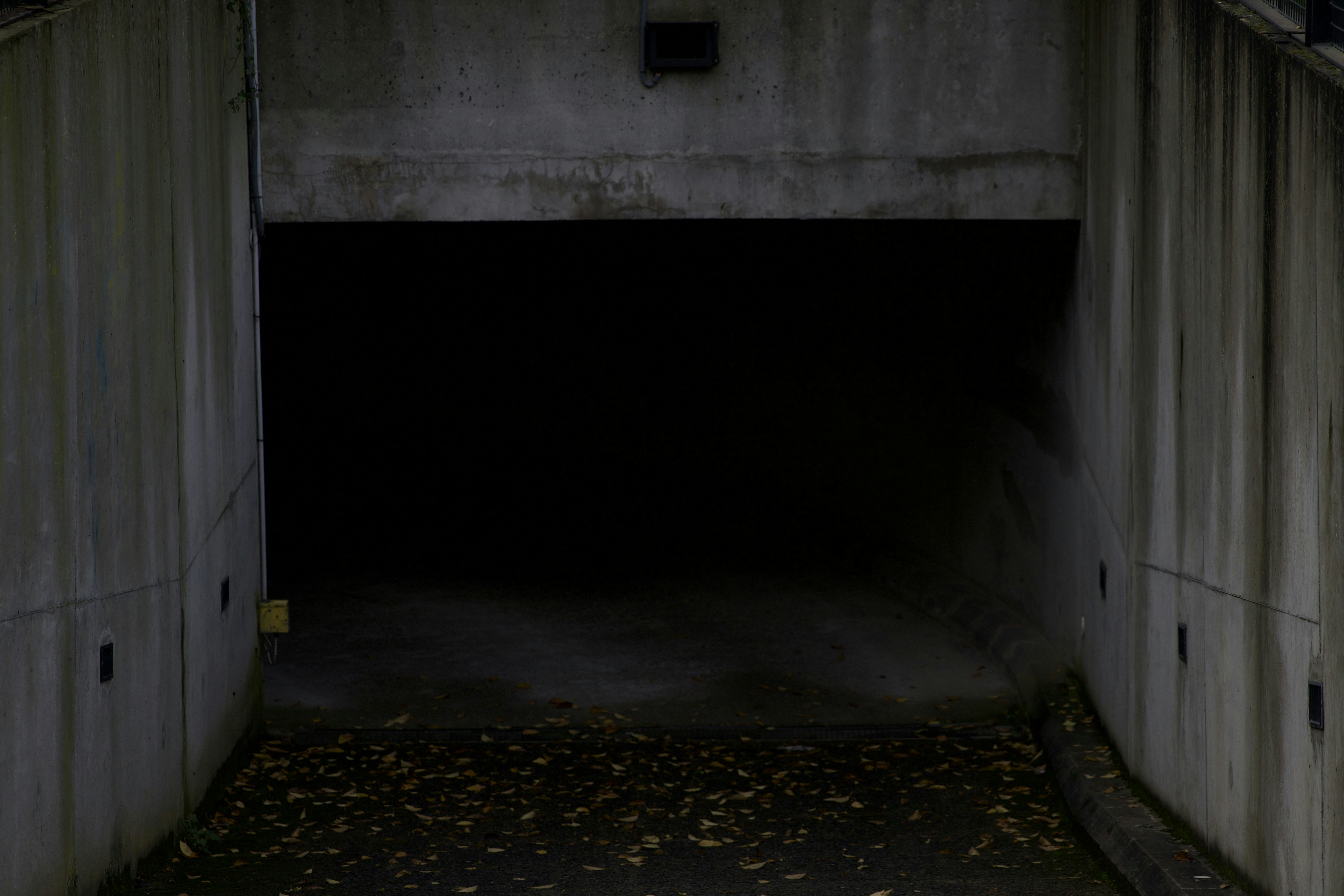 a black and white photo of a dark tunnelFlorian Stormacq