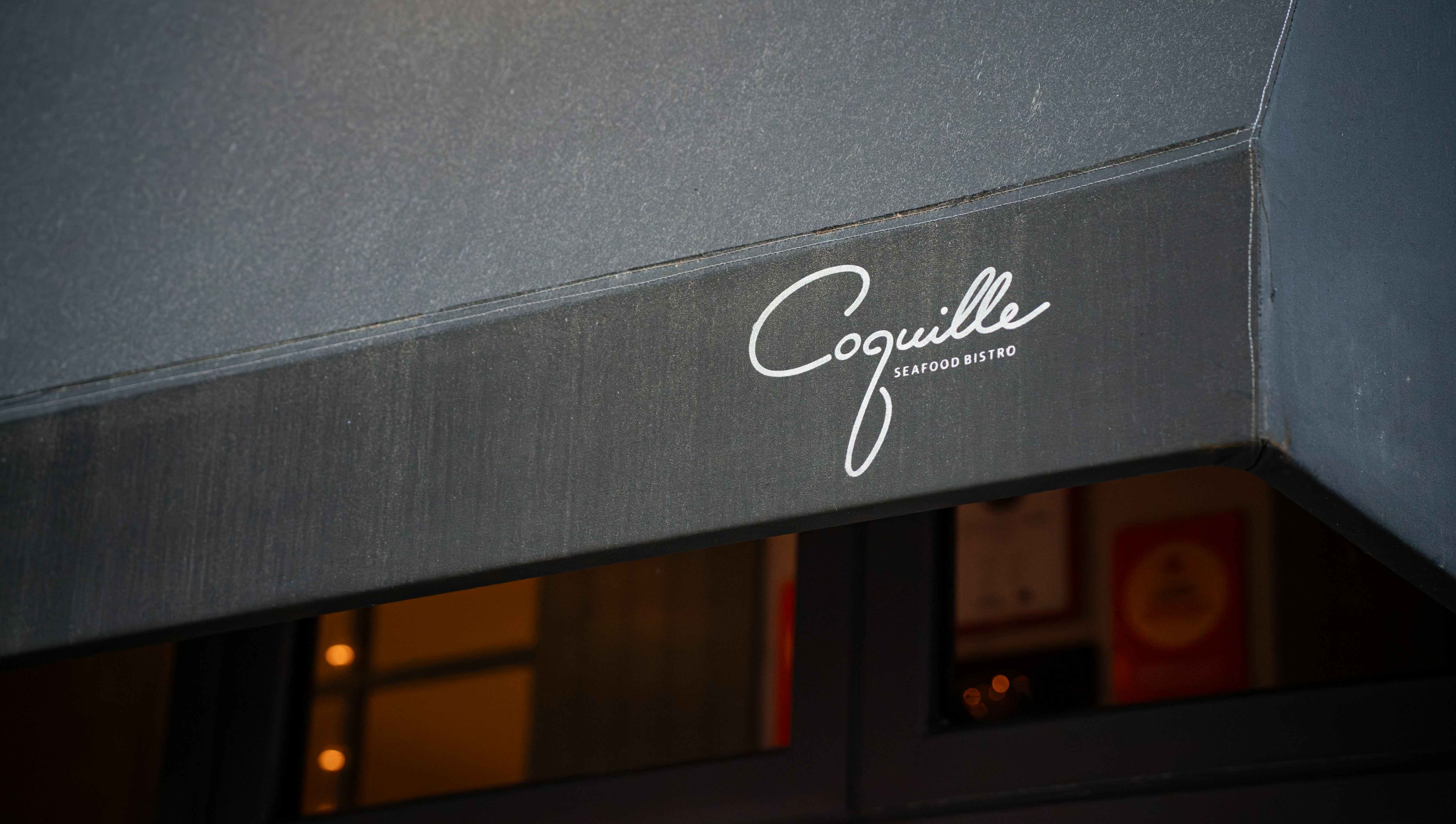 A close up of a sign on the side of a building photo – Free Storefront ...