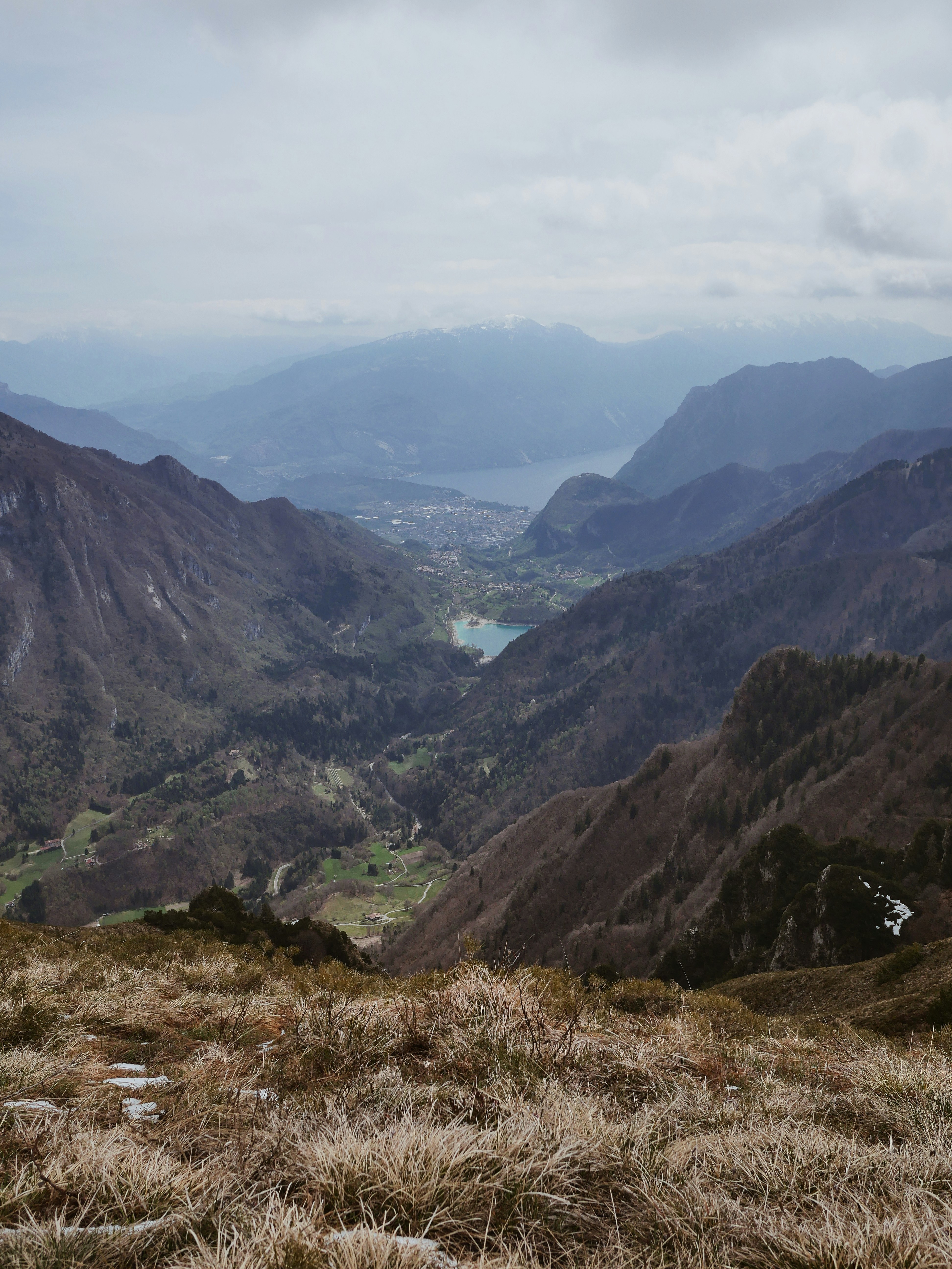 A view of a valley with mountains in the background photo – Free ...