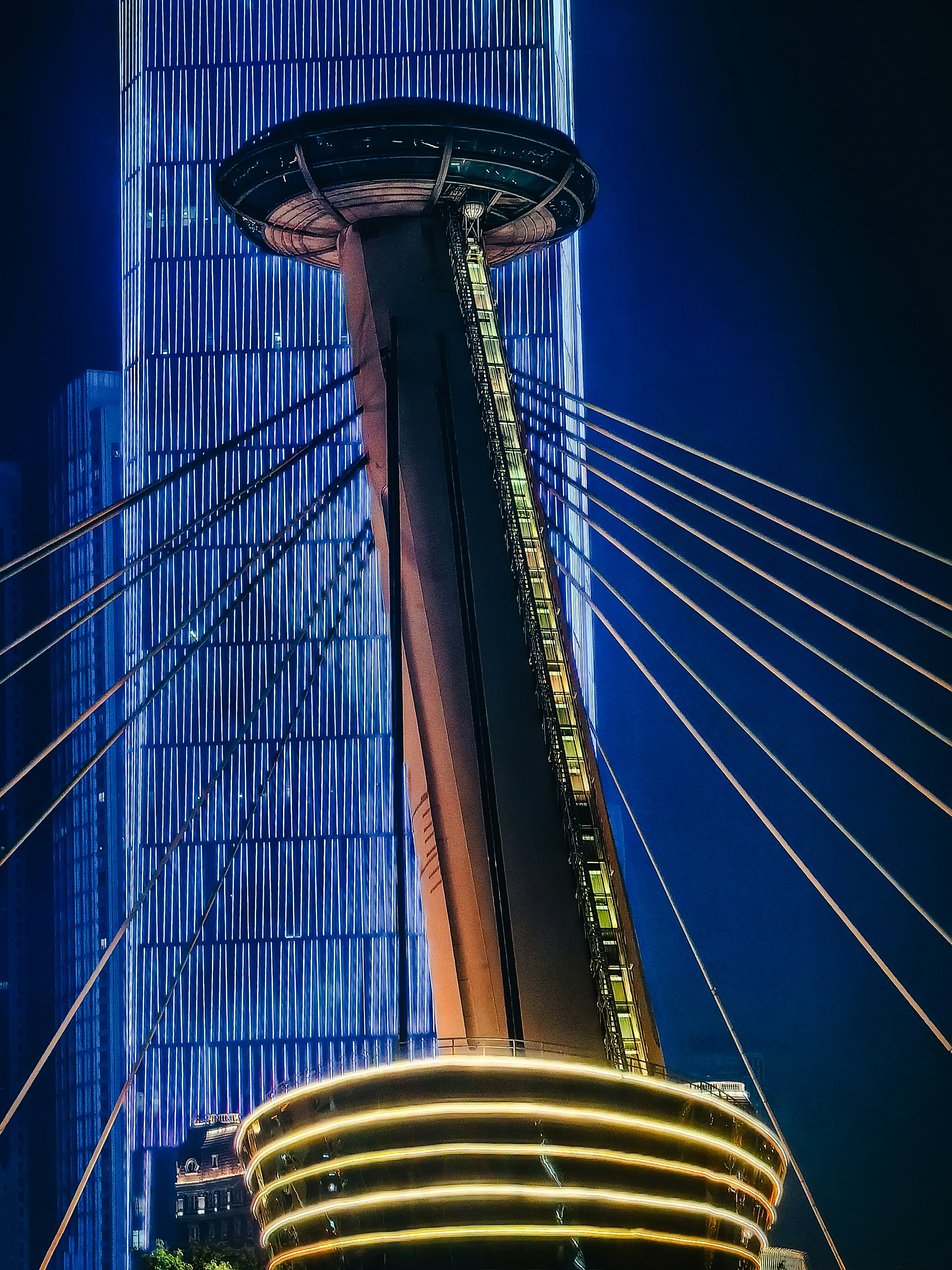 A very tall building with a very tall tower in the background photo ...