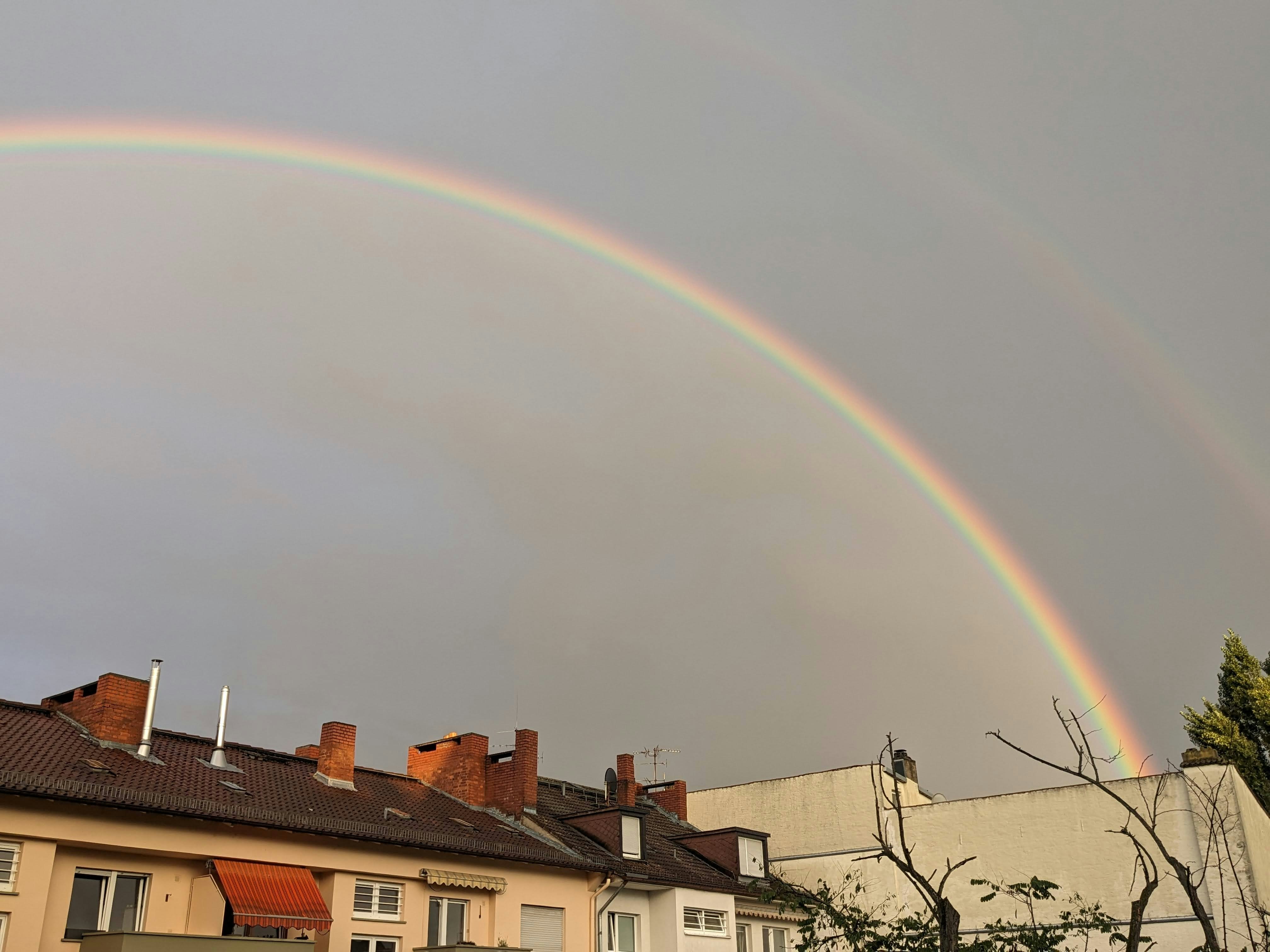 Double Arc Over Urban Rooftops