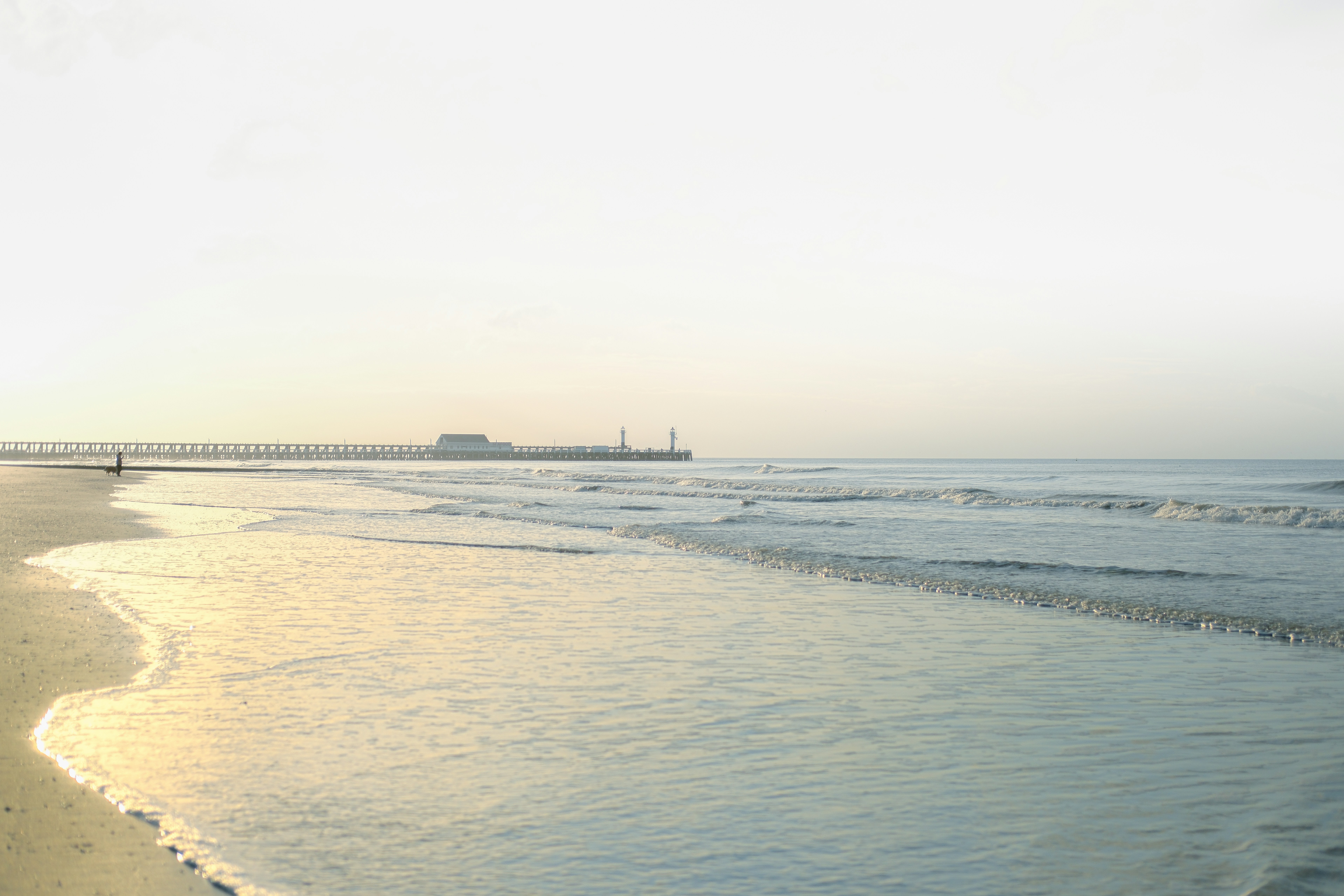 Serene Morning Waves by the Pier