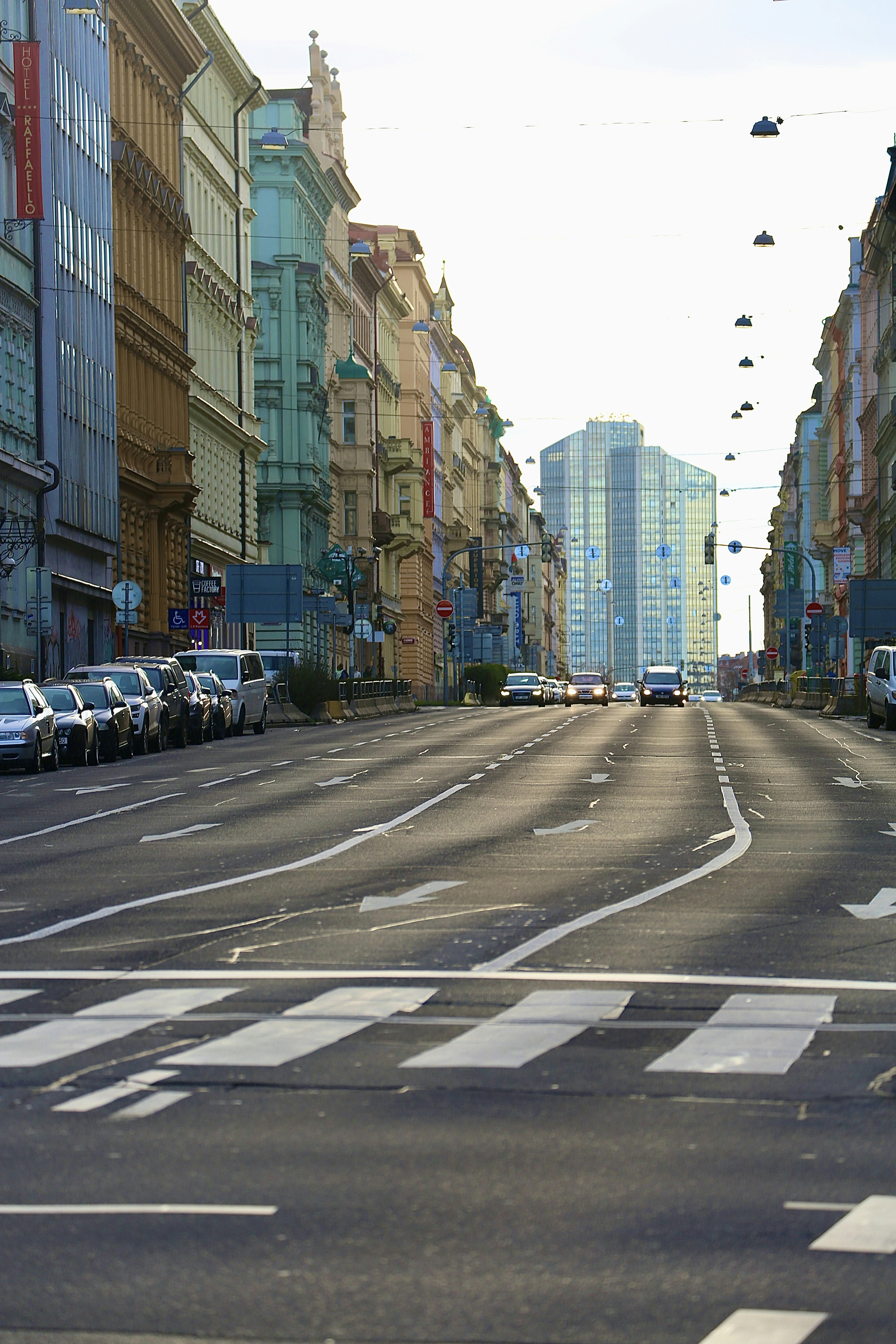 A city street with cars parked on both sides of the street photo – Free ...