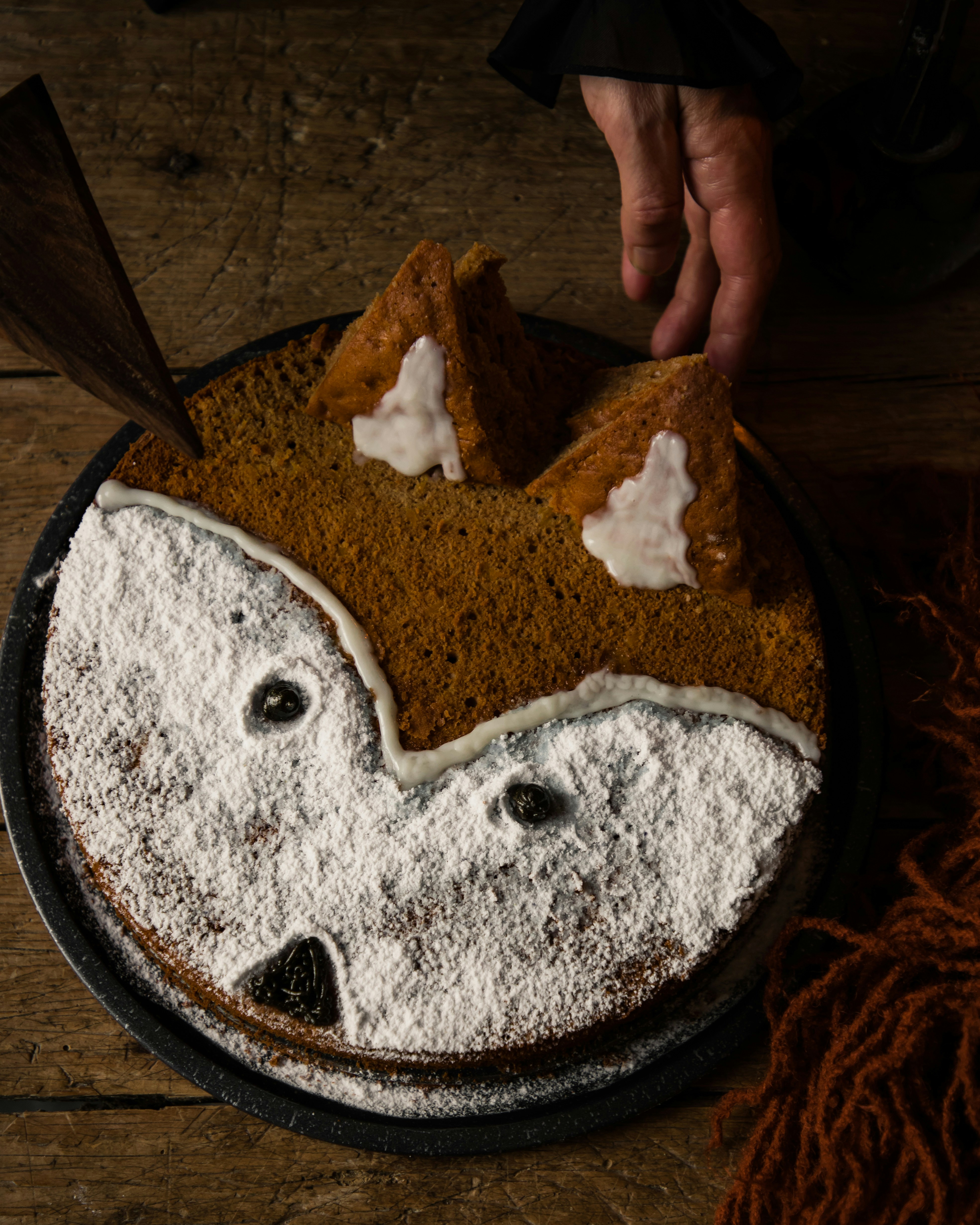 Powdered-Sugar Santa Crowned by Cookie Triangles on a Rustic Cake