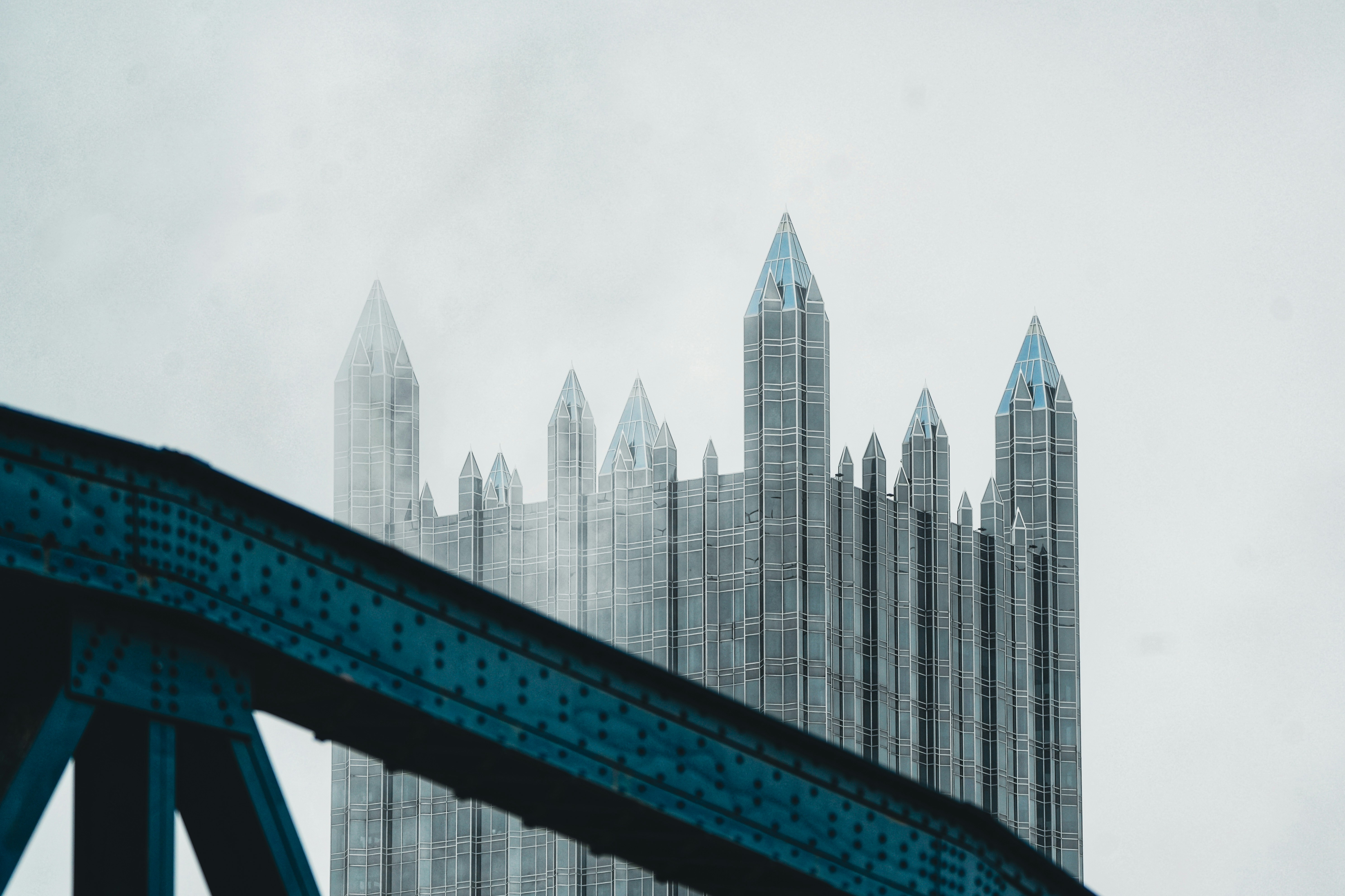 A view of a very tall building from across a bridge photo – Free City ...