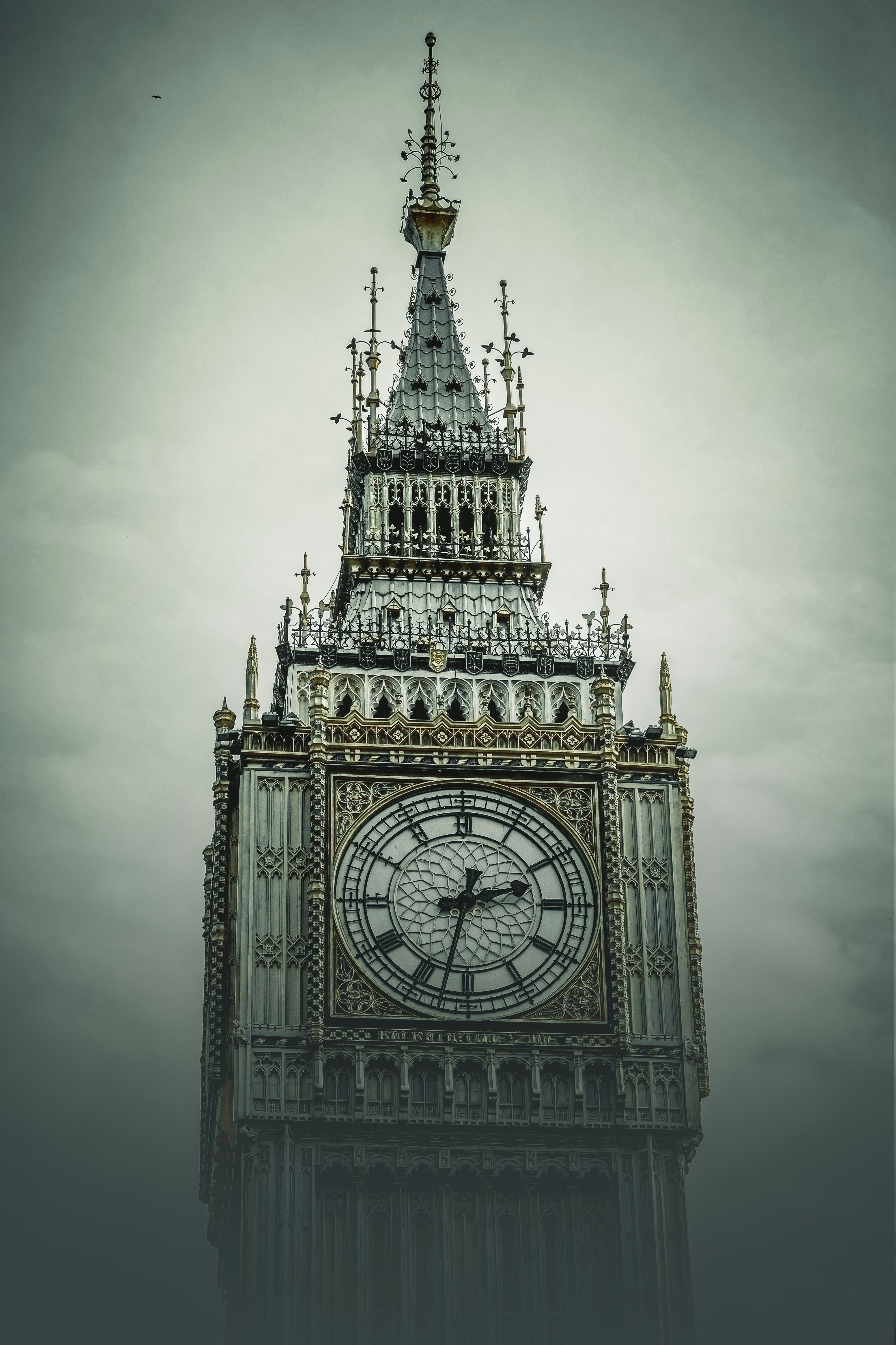 A tall clock tower with a clock on each of it's sides photo – Free ...