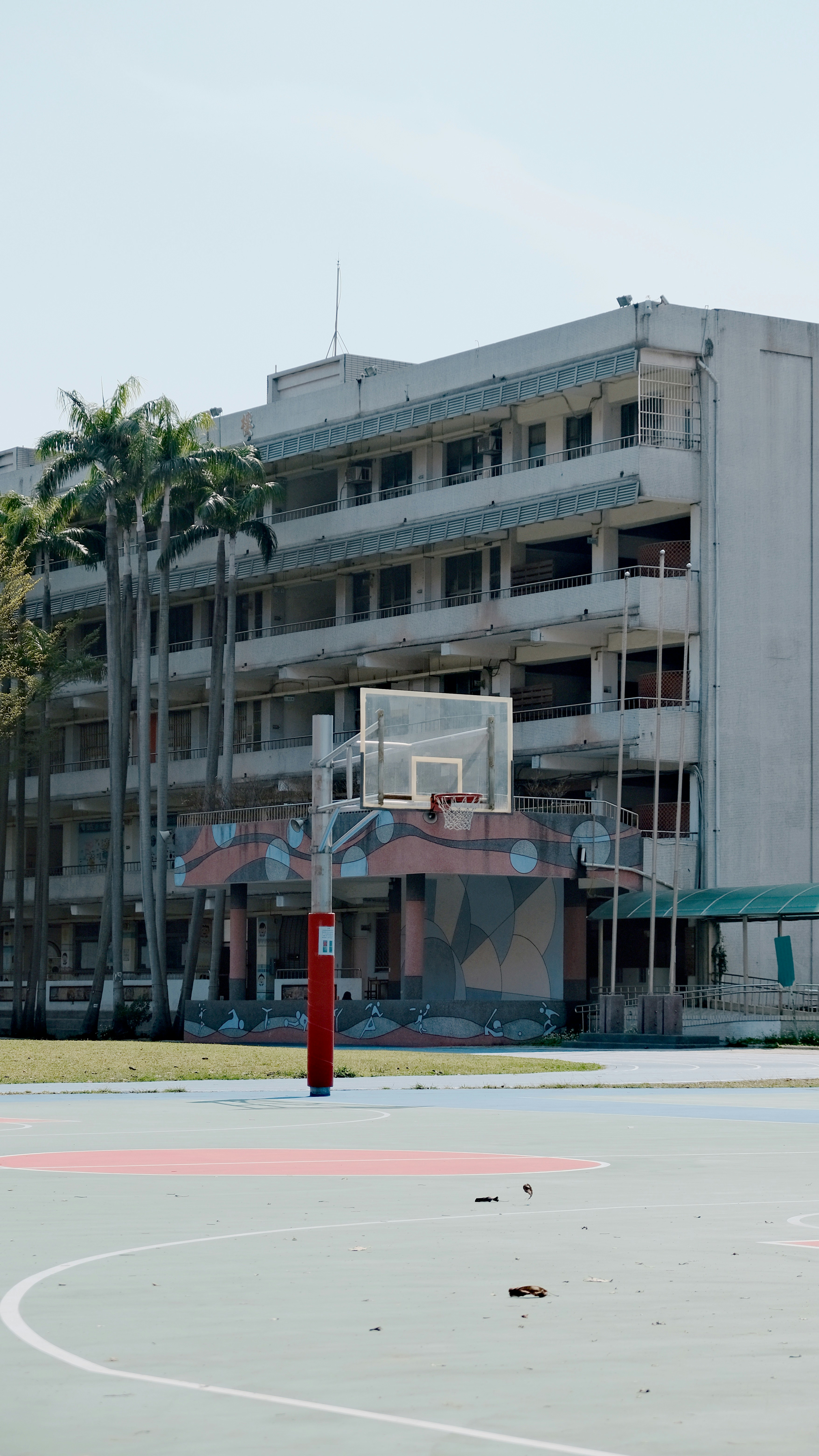 Deserted Court Under a Weathered Dormitory