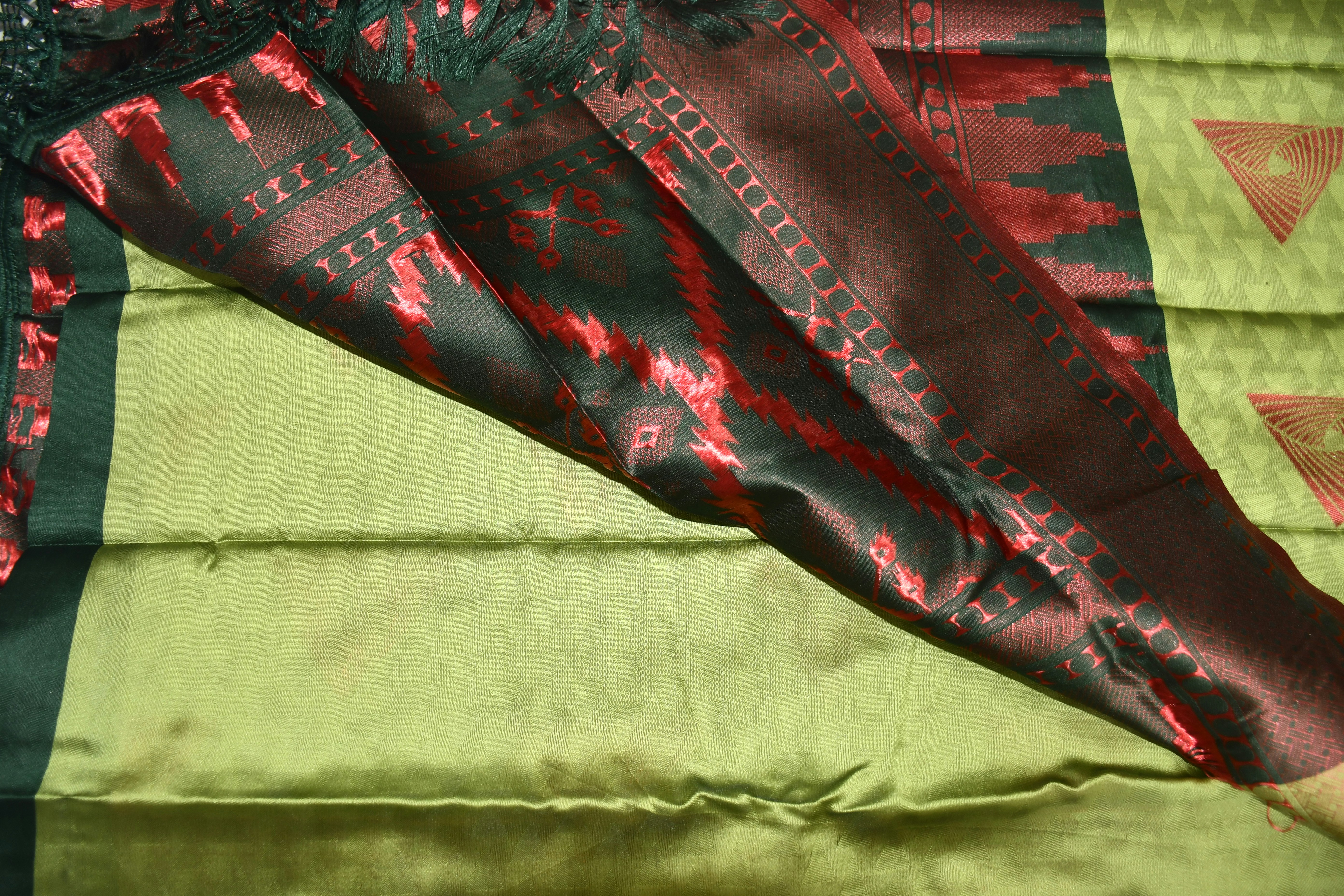 a close up of a piece of cloth on a bed