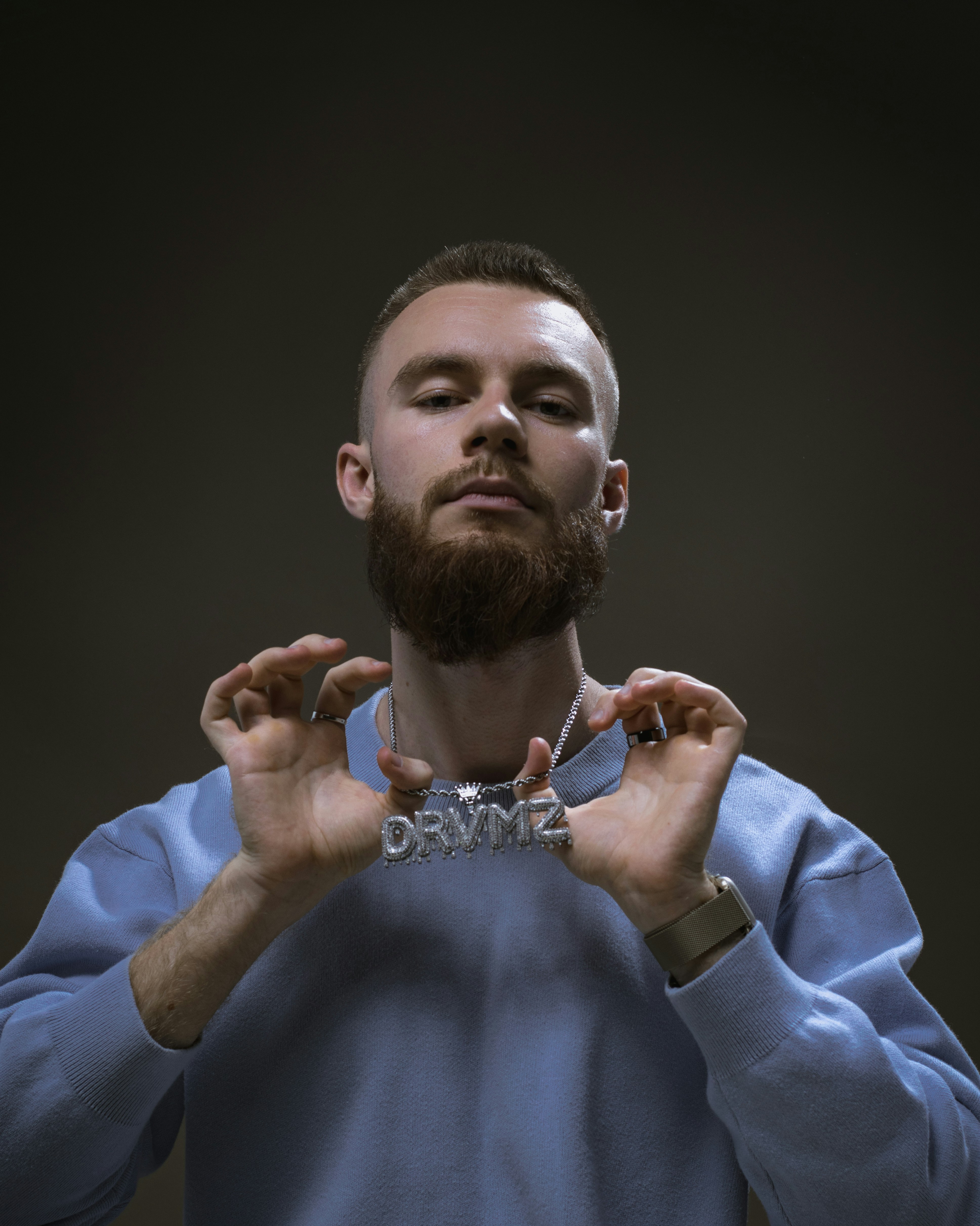 A man with a beard is holding his hands together photo – Free Style ...