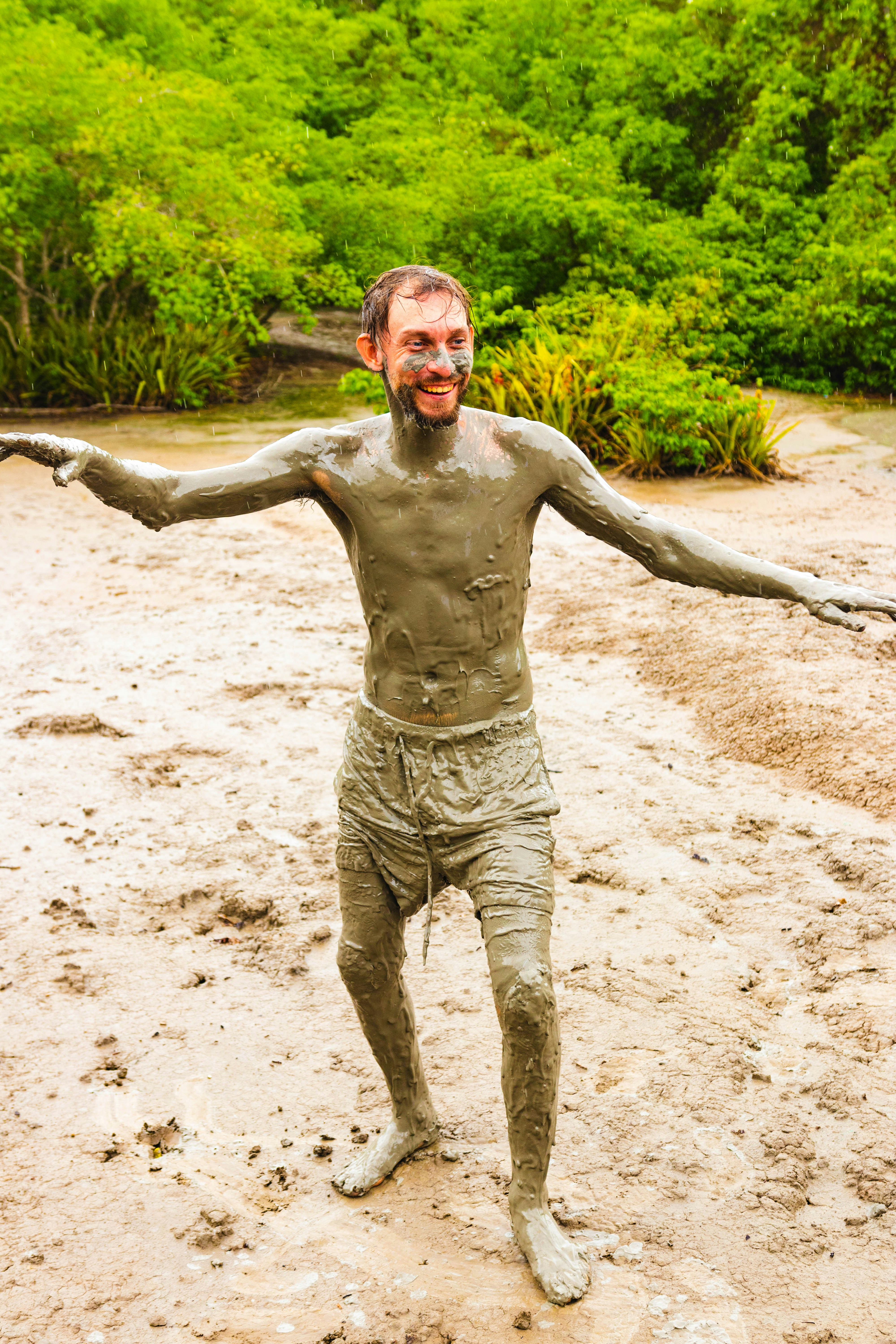 A man with mud on his face and arms photo – Free Portrait Image on Unsplash