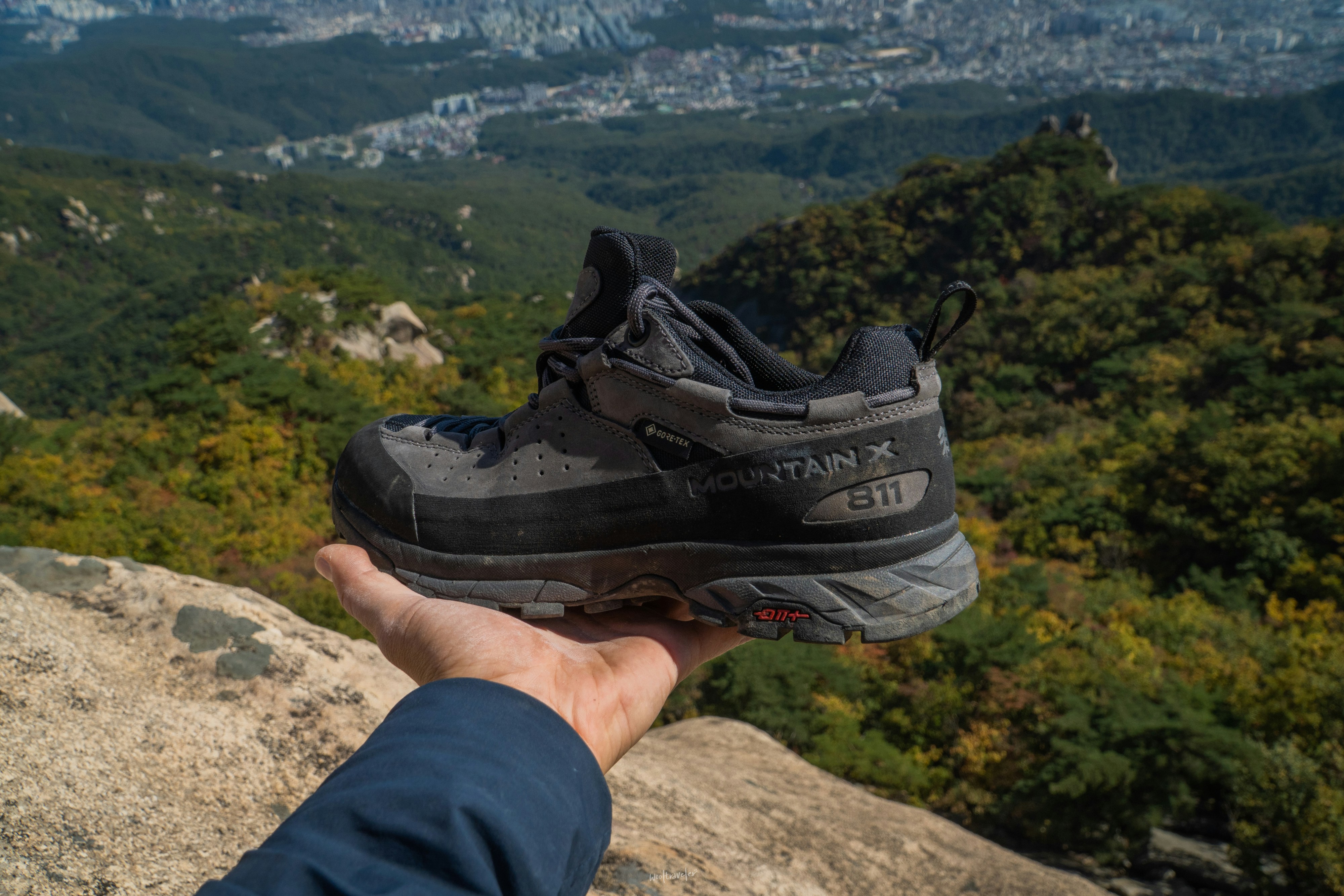 Holdfast on the Horizon: A Hiking Shoe Framed by a Mountain Ridge