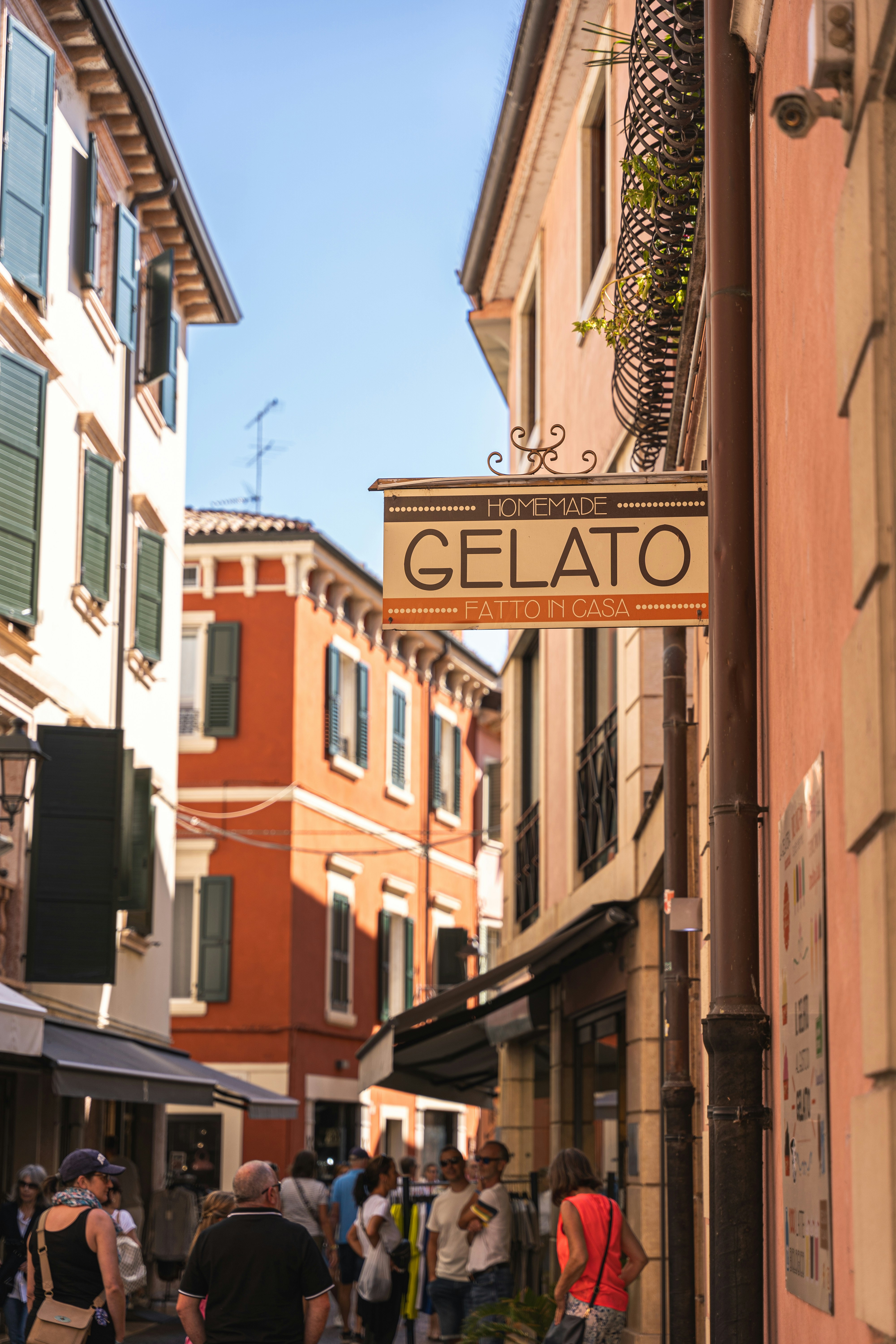 Sunlit Gelato Lane: A Narrow Italian Street Framed by Warm Facades