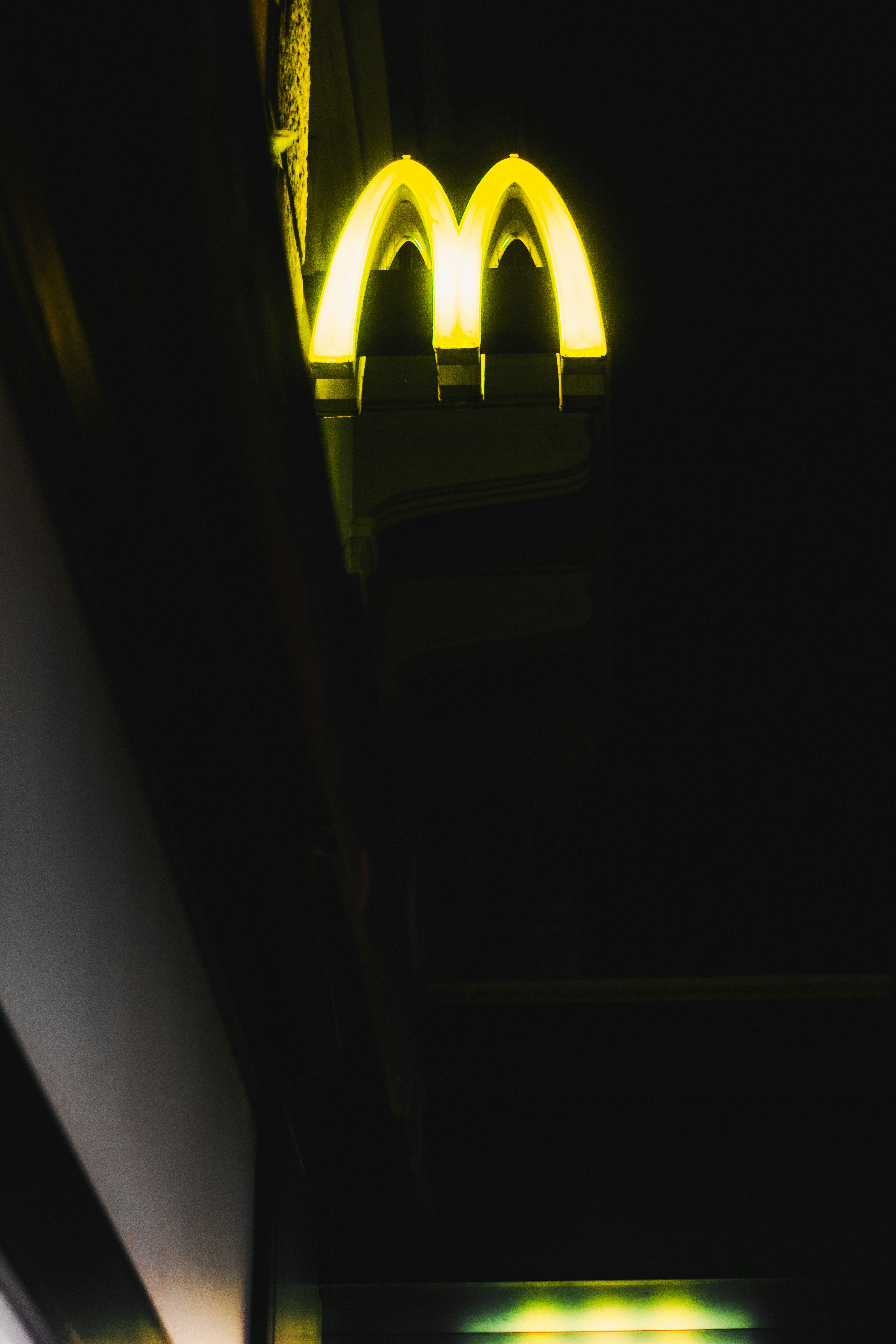 Nighttime Neon Arches: The McDonald's Sign in the Shadows