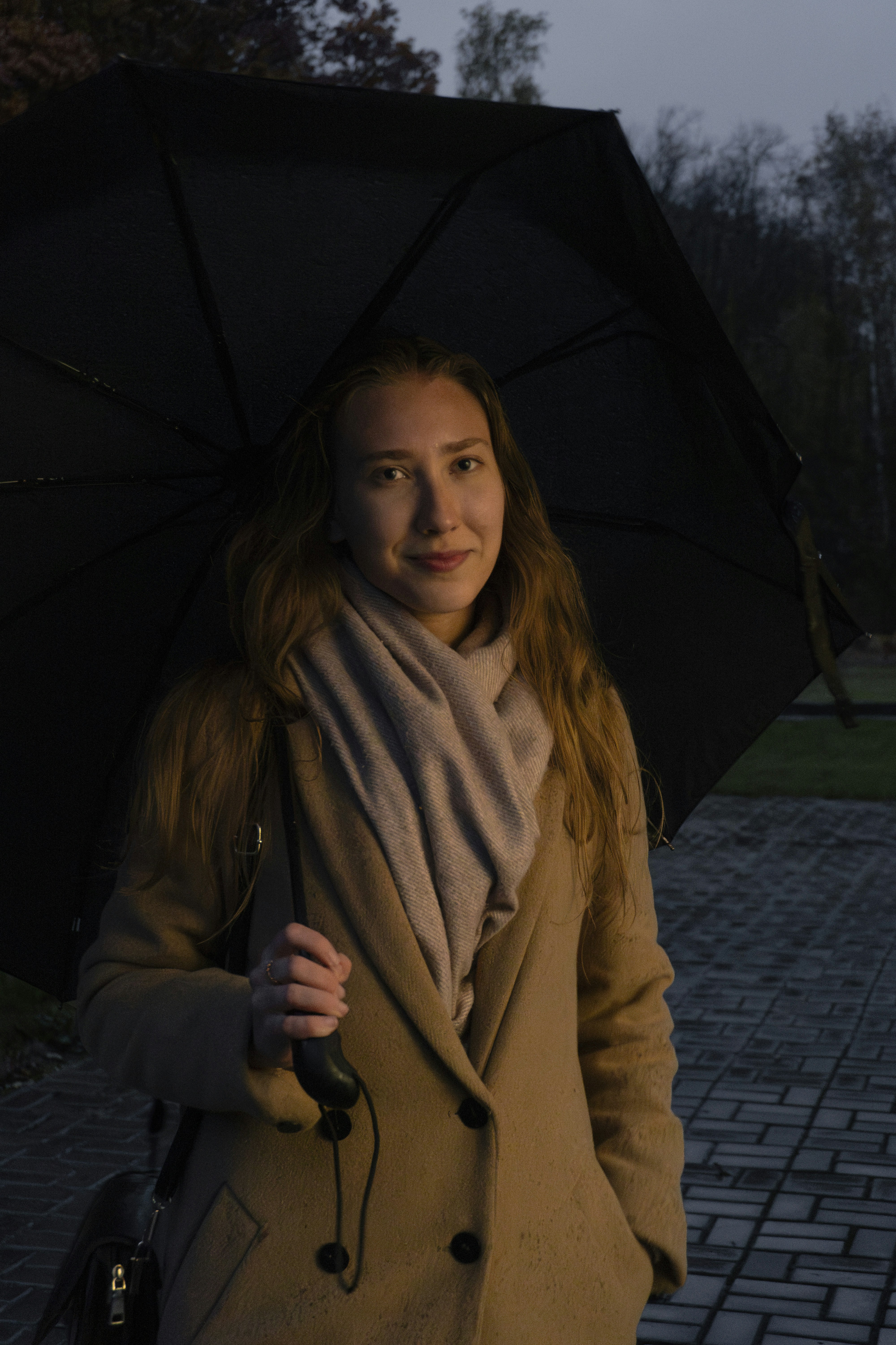Umbrella Under Evening Clouds: A Quiet Portrait in Warm Light
