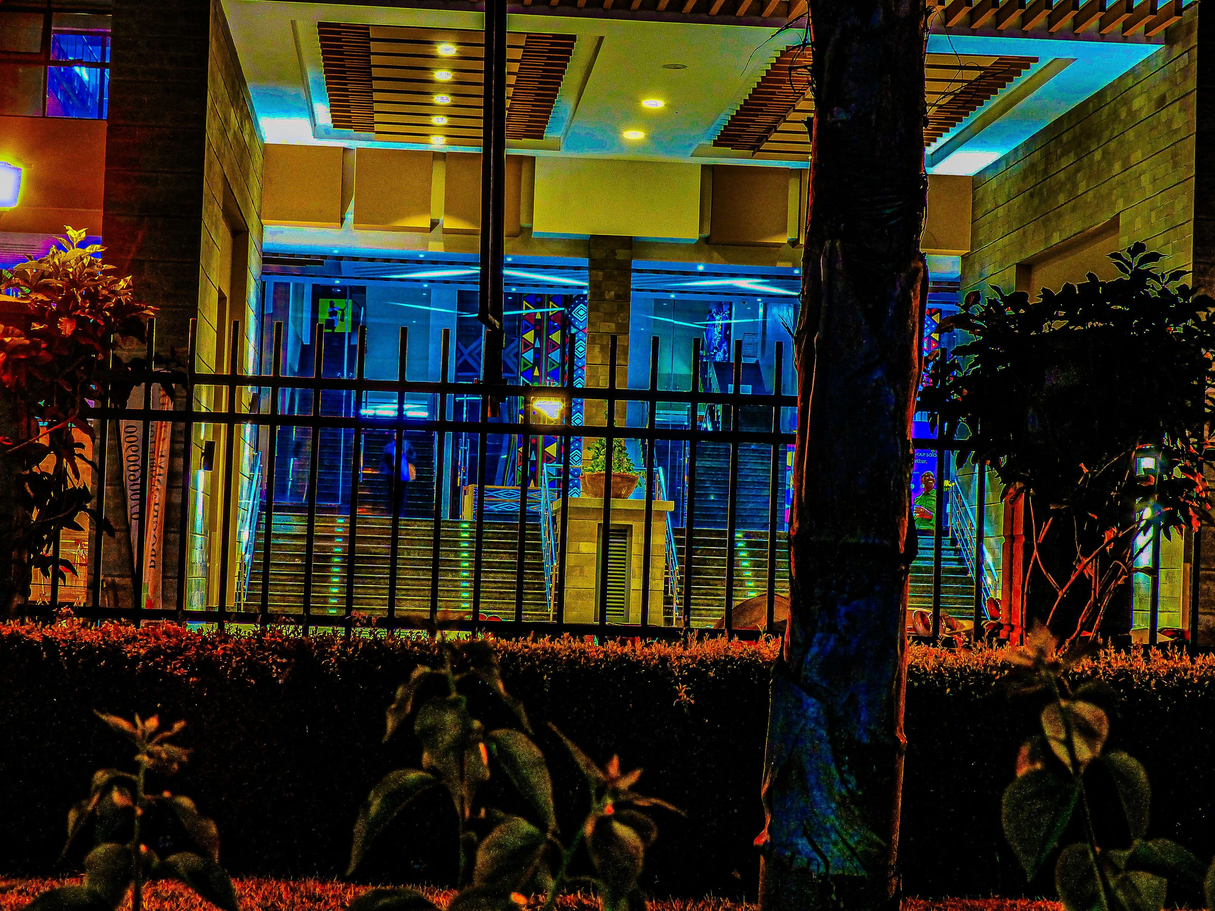 A building lit up at night with lights on photo – Free Kitengela mall ...