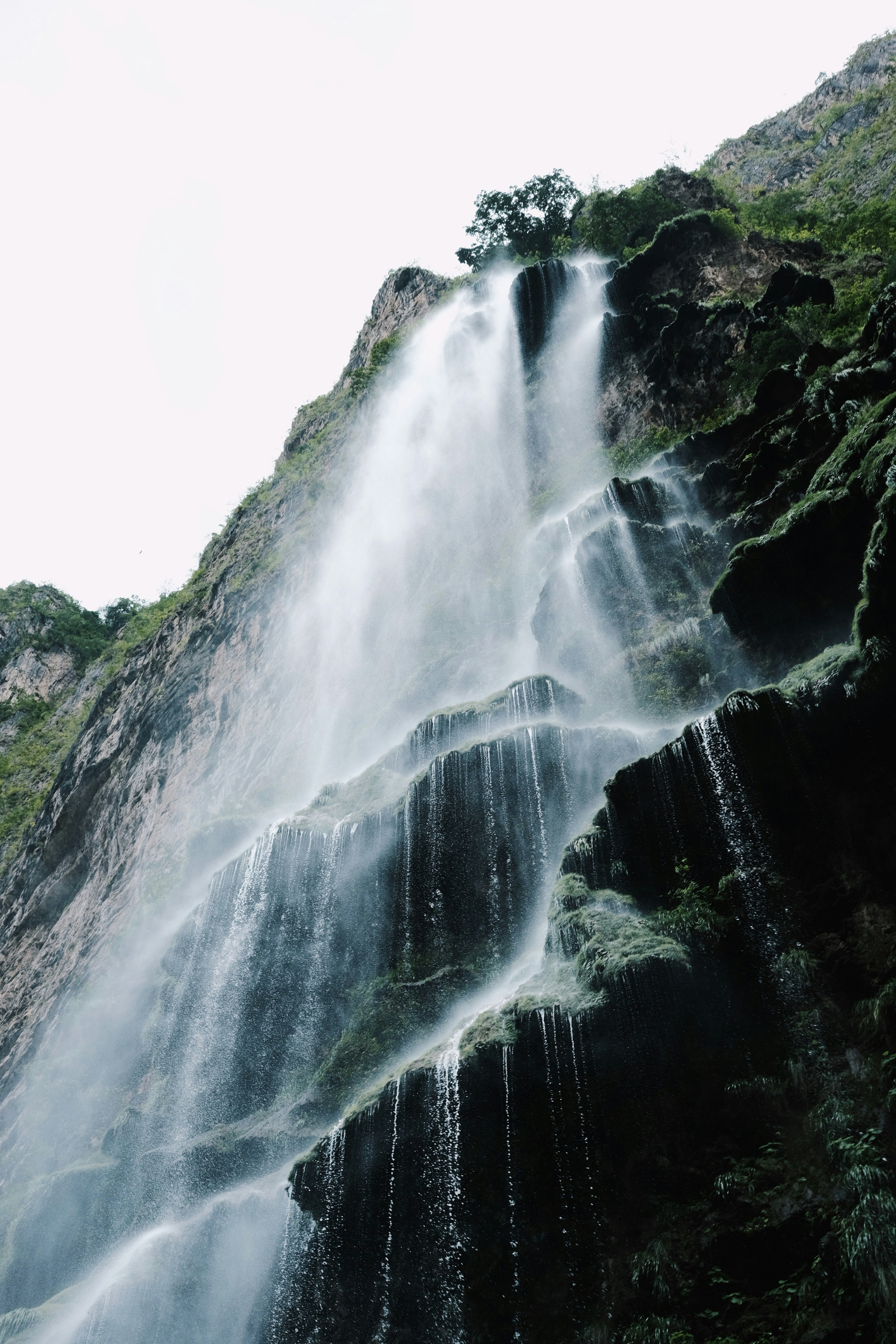 A very tall waterfall with lots of water coming out of it photo – Free ...