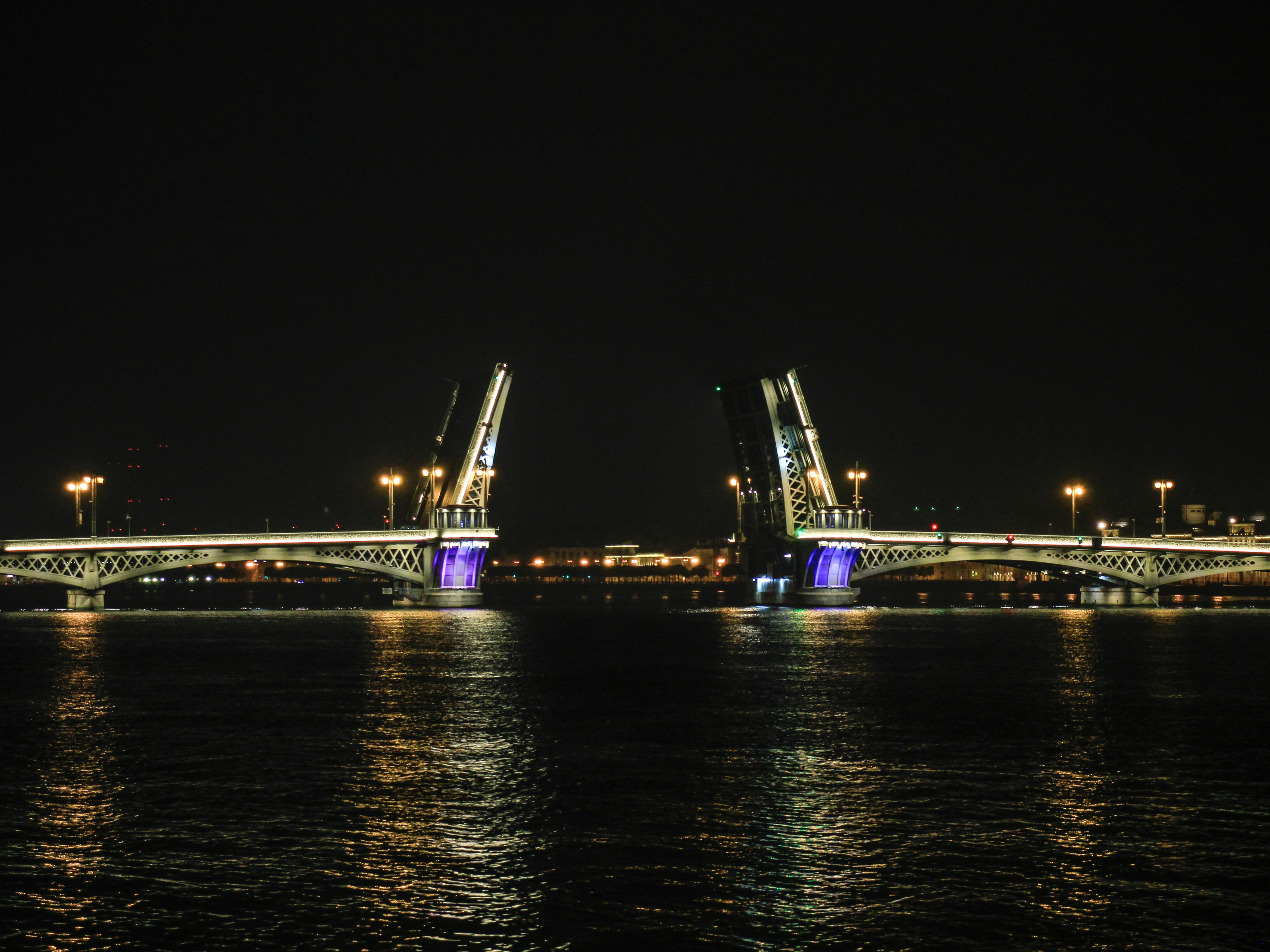 Twinned Lift Bridges at Night: Echoes of Light on a Quiet River