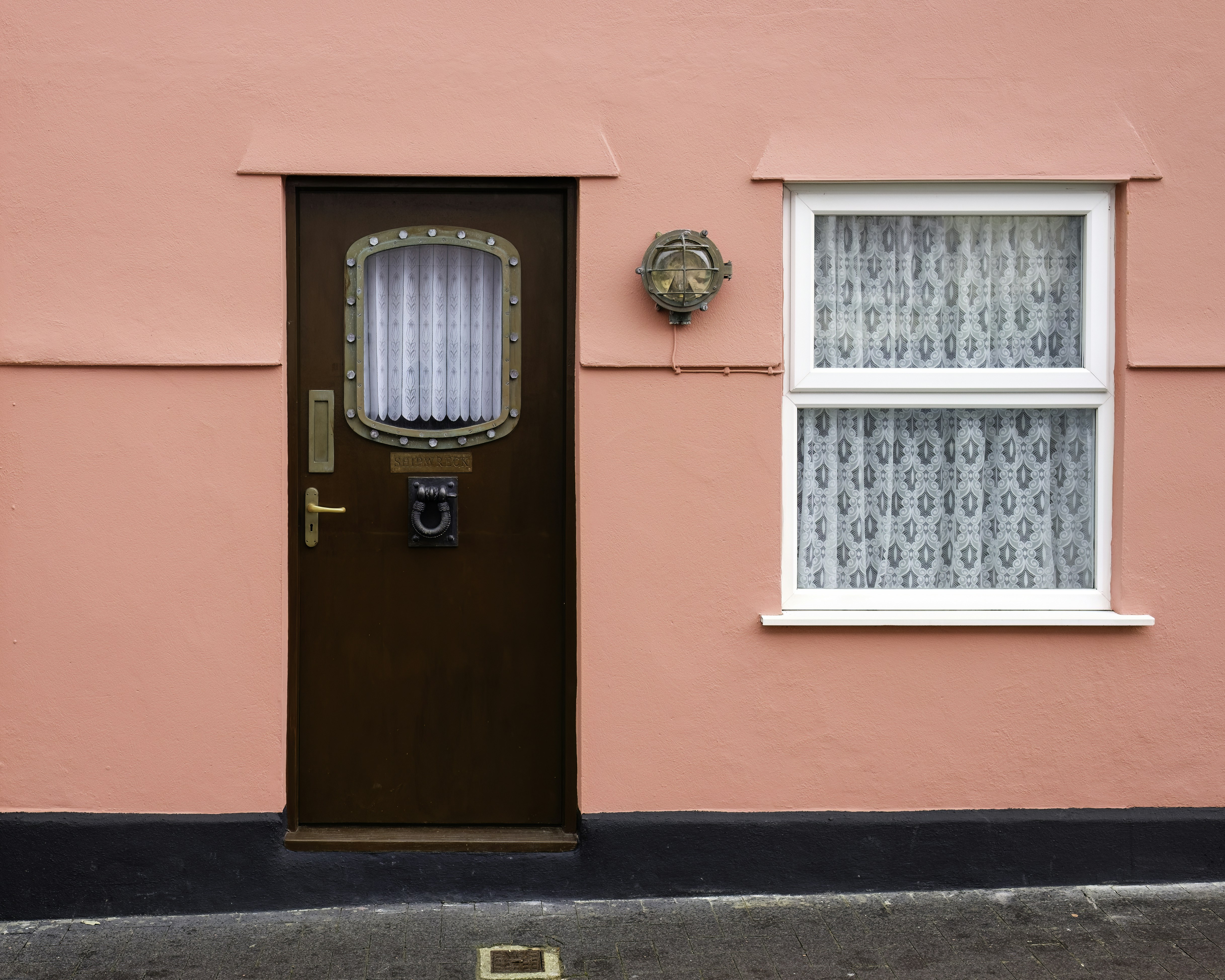 A pink house with a brown door and window photo – Free Window Image on ...
