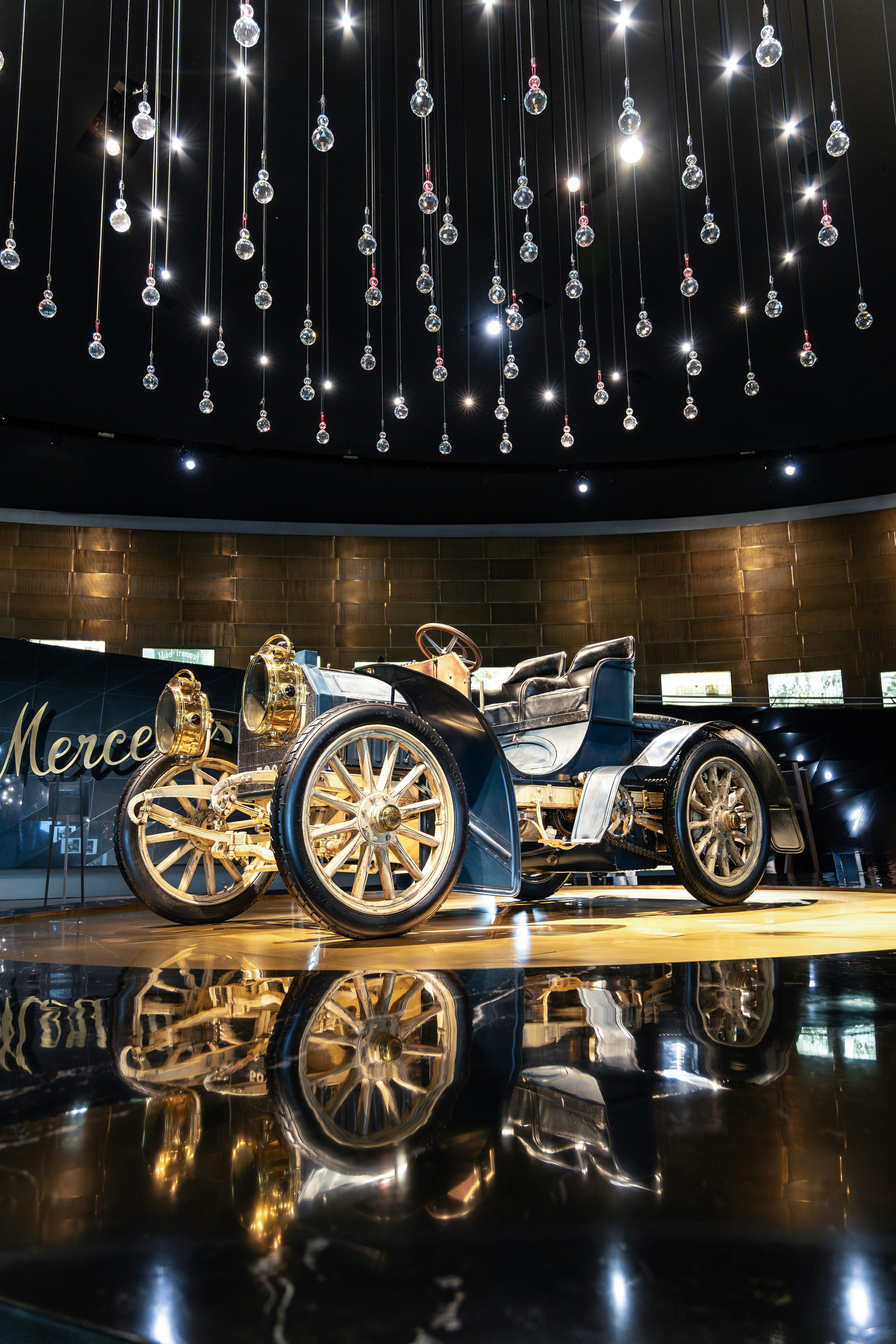A car on display in a building with chandelier photo – Free Stuttgart ...