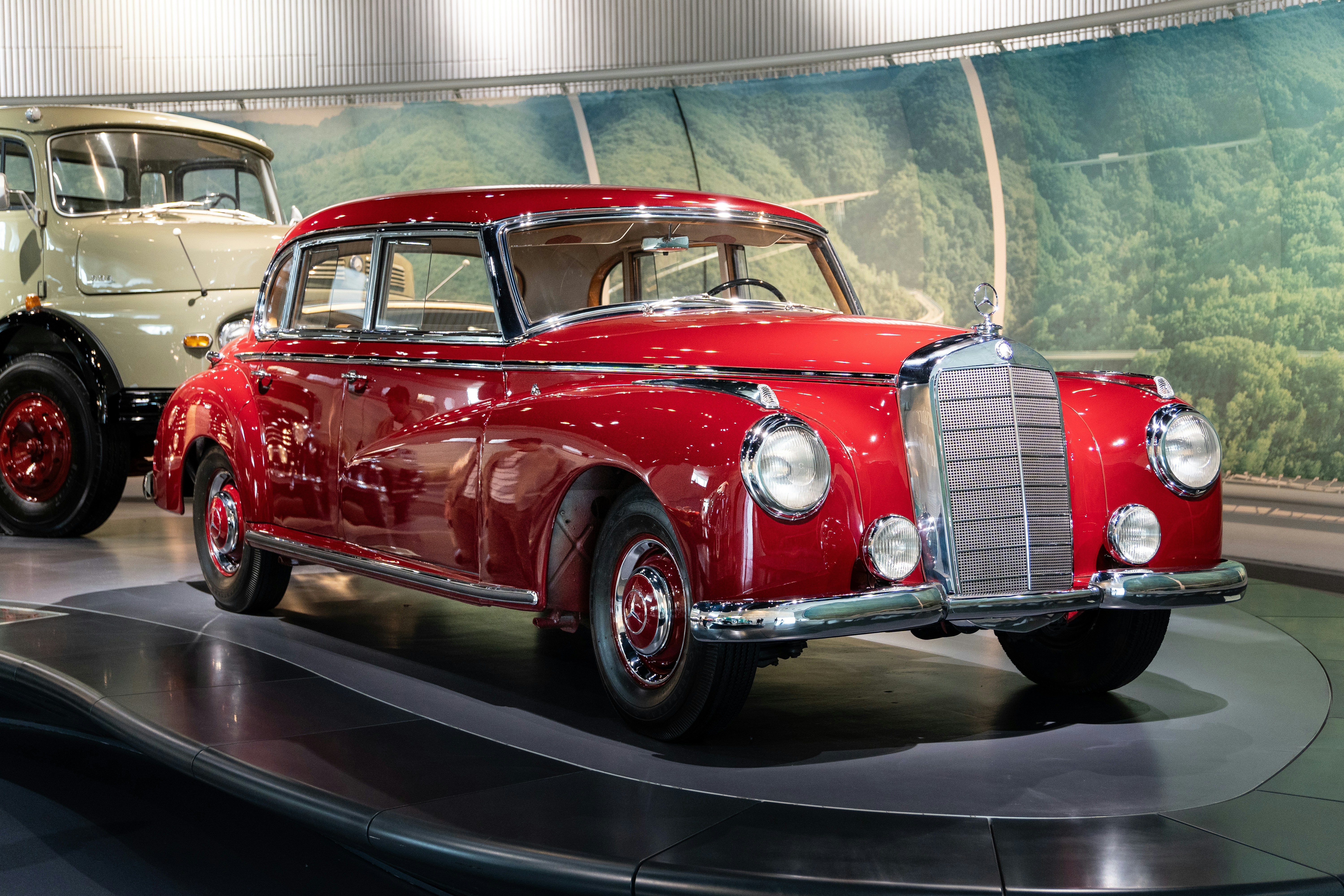 A red and white car on display in a museum photo – Free Stuttgart Image ...
