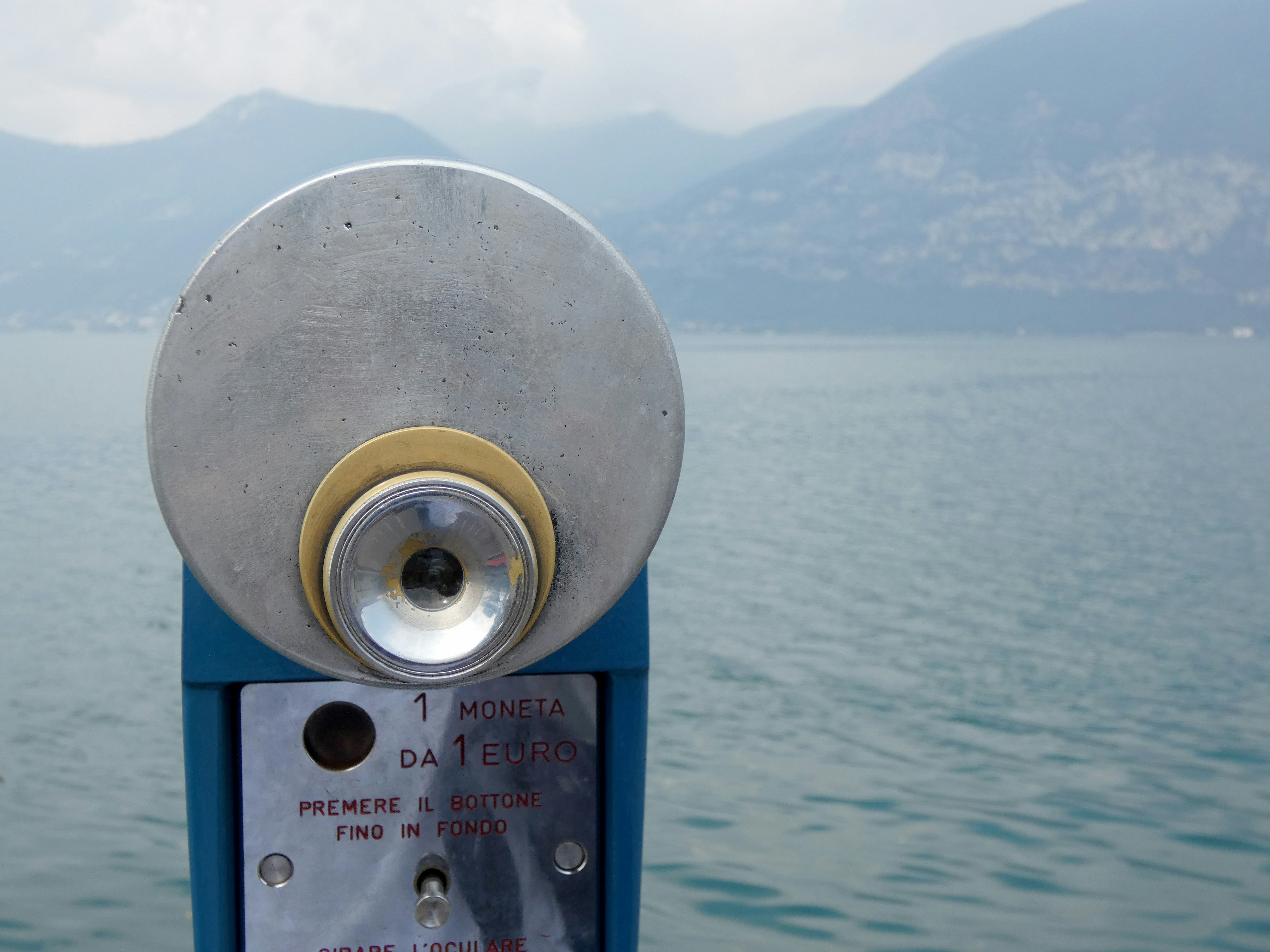 Vintage Telescope Overlooking Misty Waters