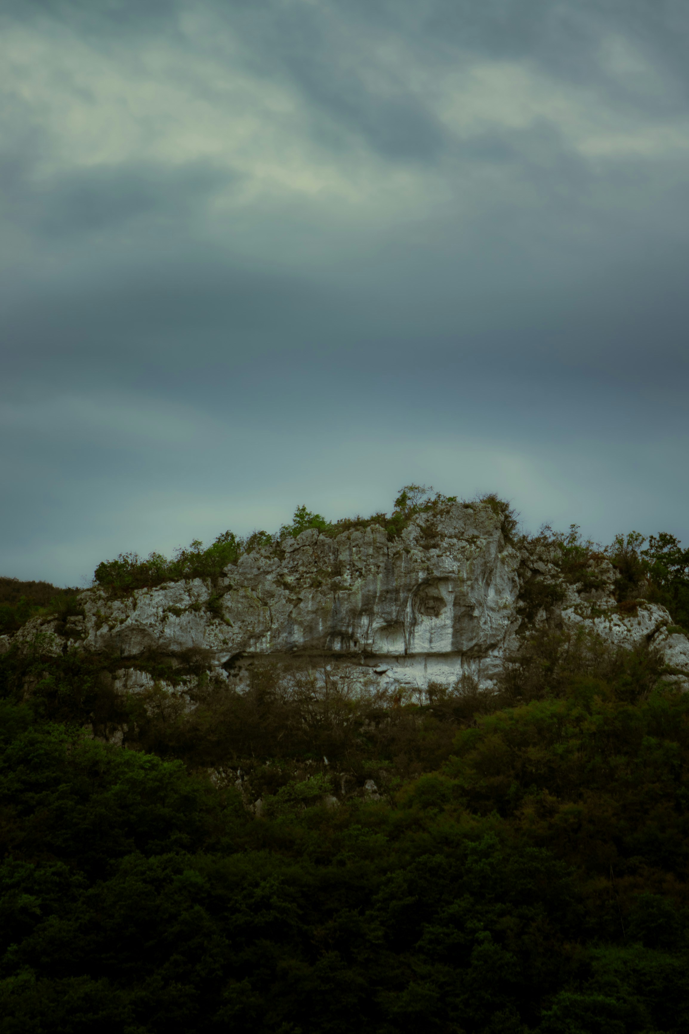 Granite Crown Beneath a Tempest-Tinged Sky