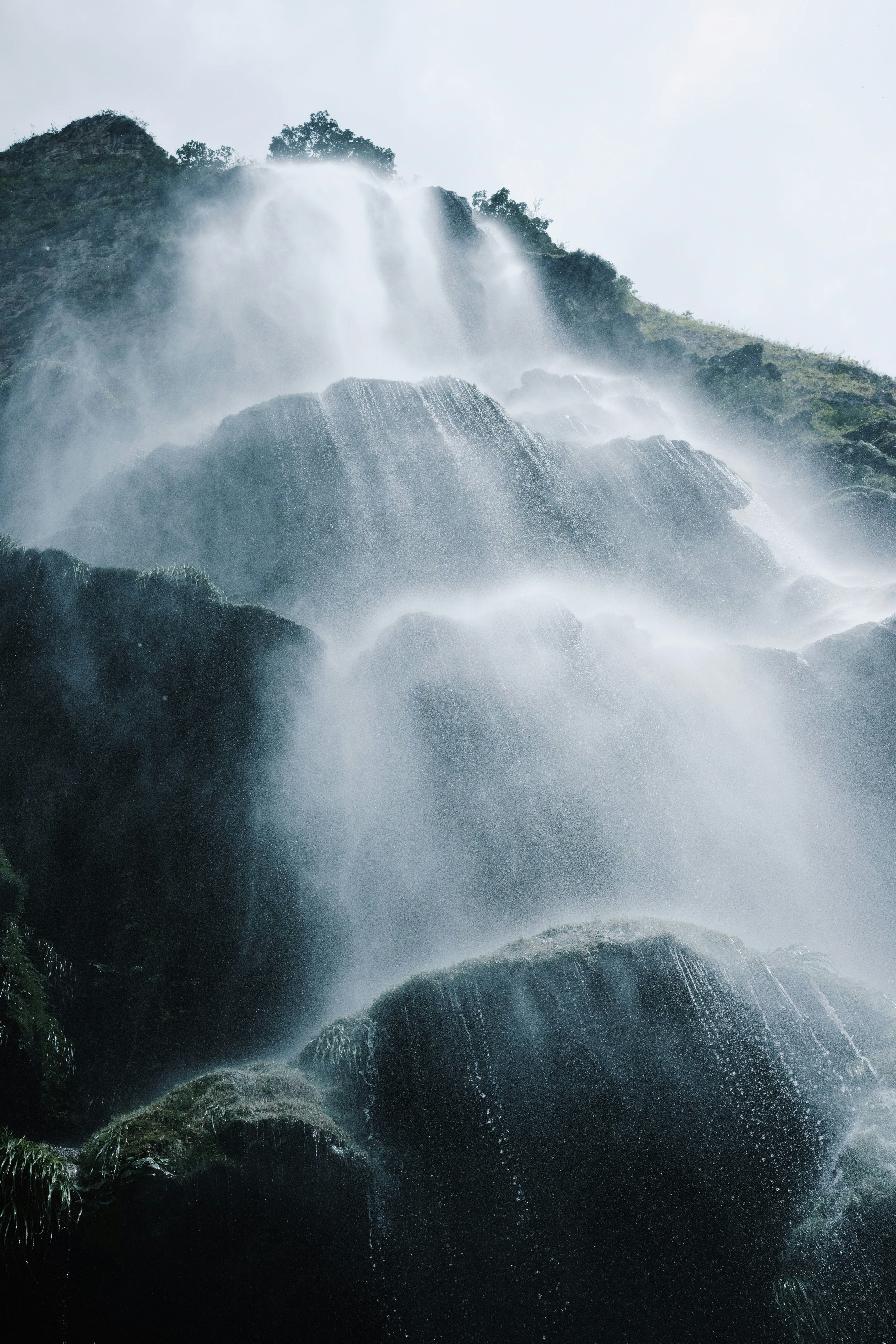 A very tall waterfall with lots of water coming out of it photo – Free ...