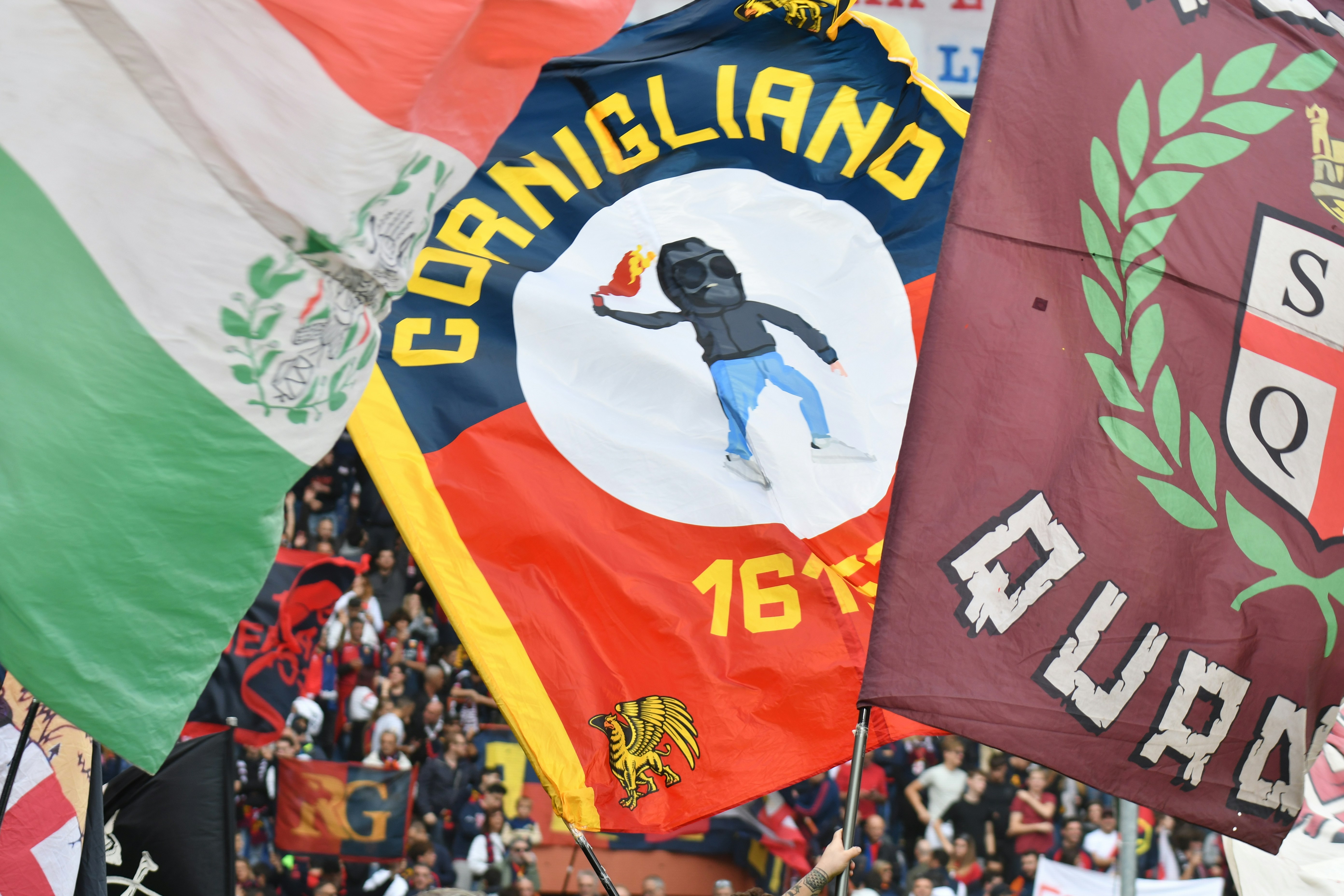 Red Banner Cartoon Centerpiece Amid a Kaleidoscope of Flags