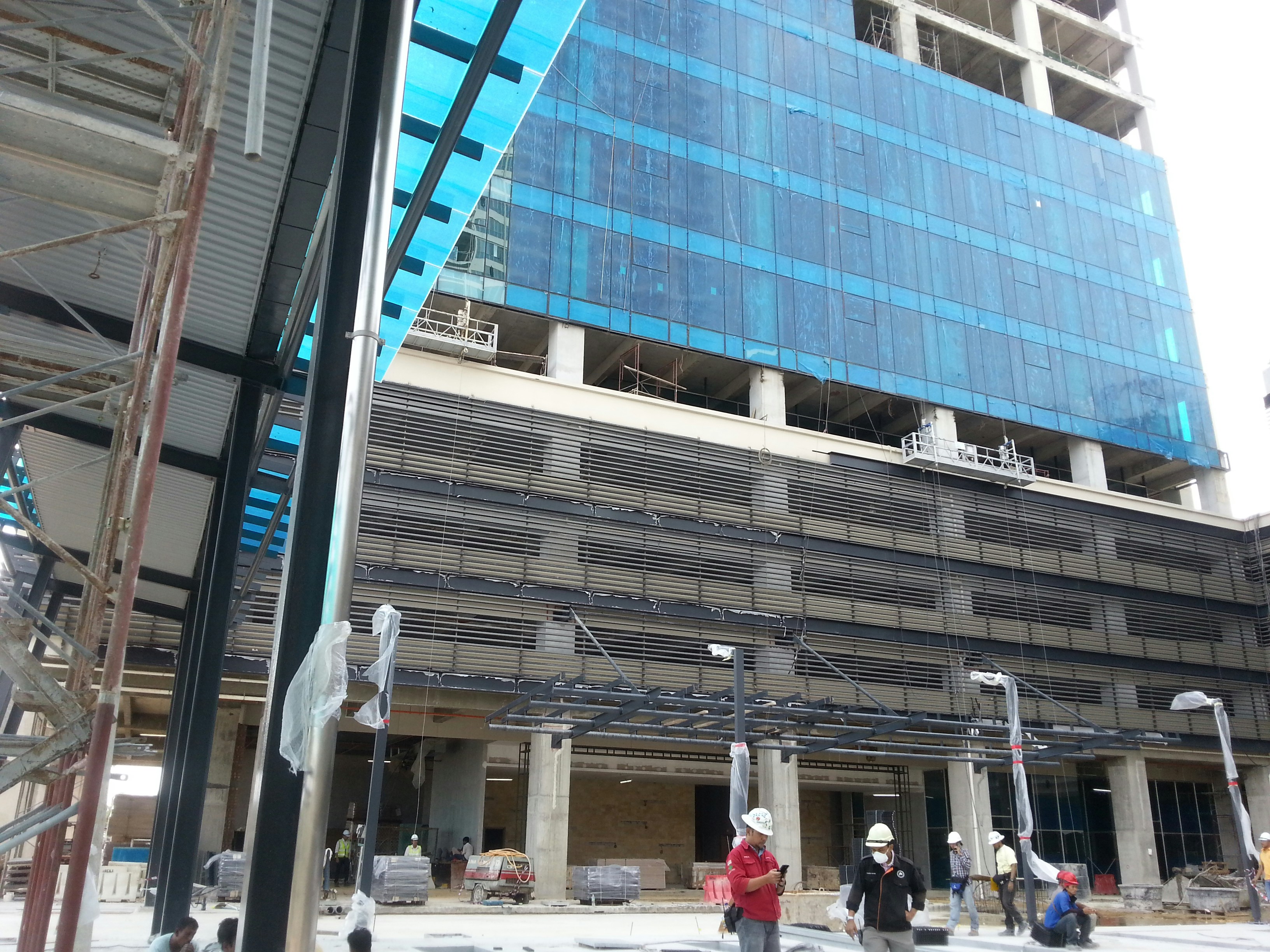 A tall blue building with a lot of windows photo – Free Building Image ...