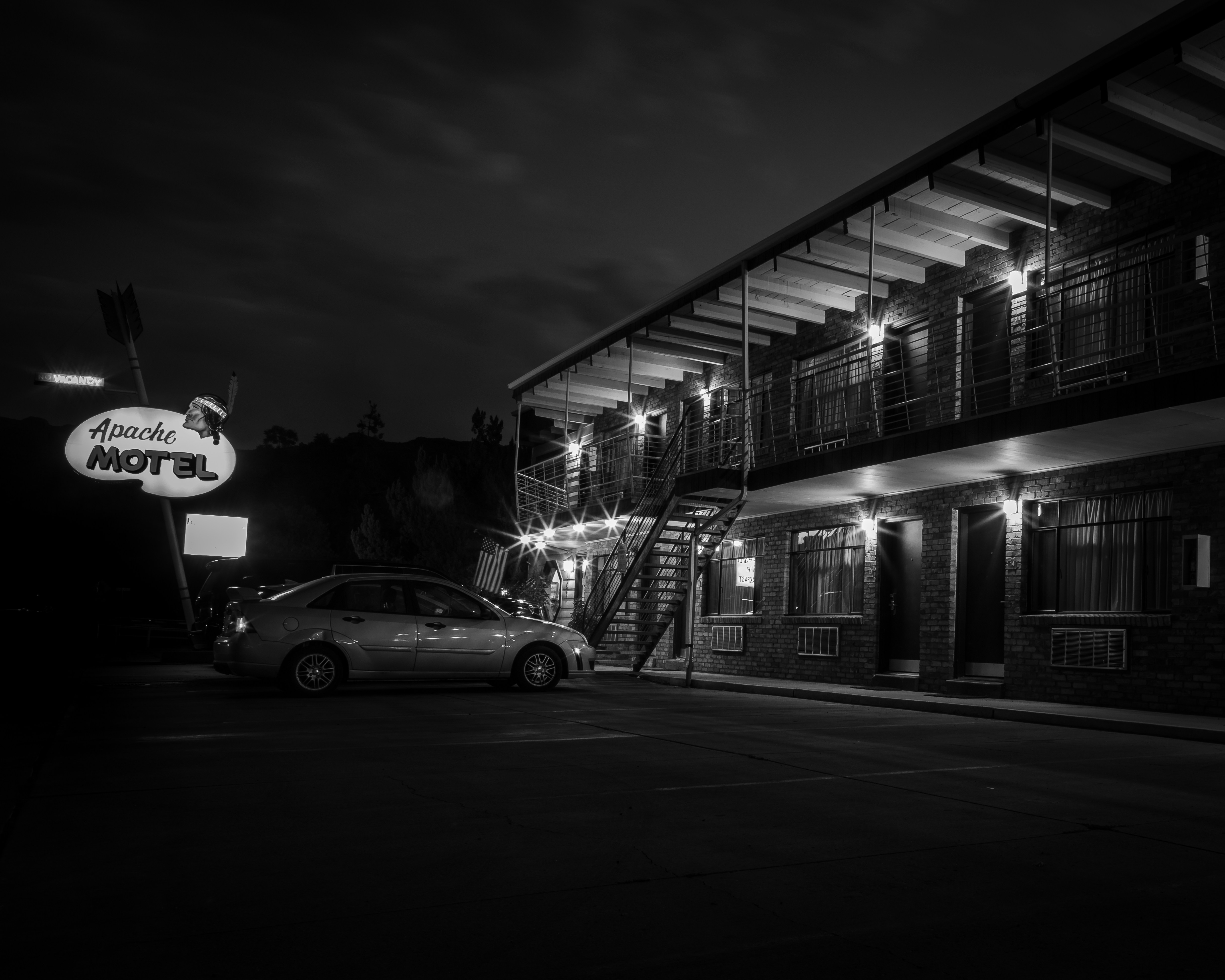 A black and white photo of a motel at night photo – Free Motel Image on ...
