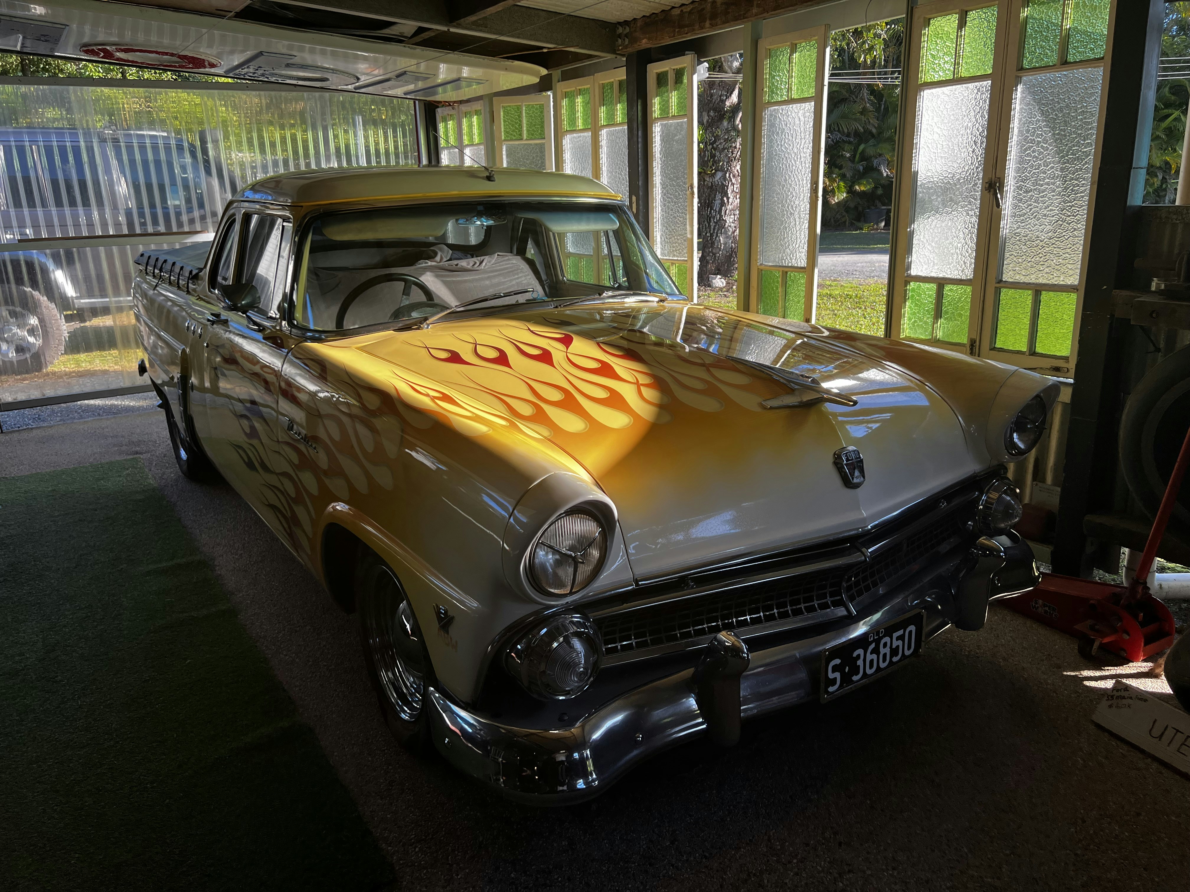 An old car with flames painted on it photo – Free Car Image on Unsplash