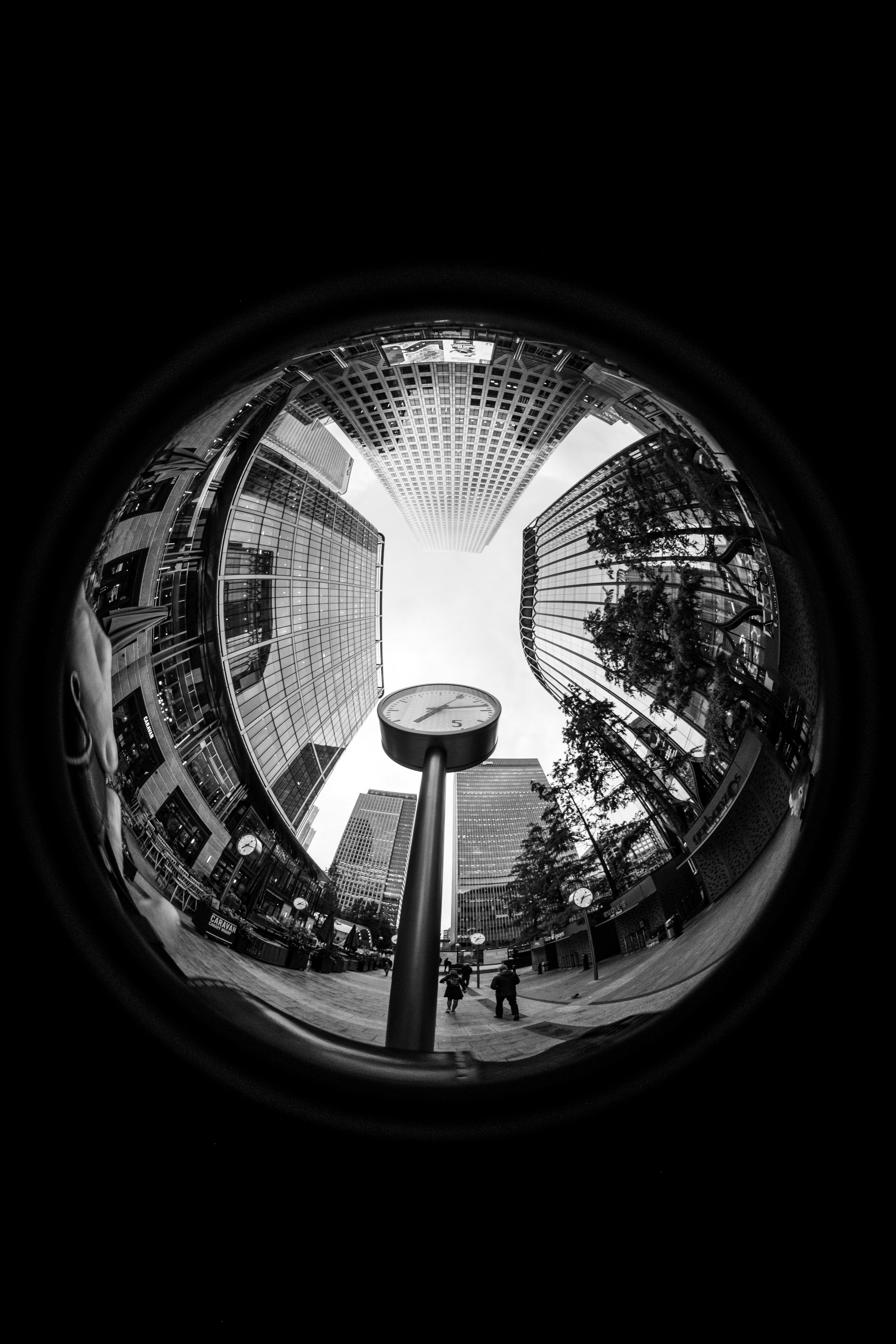 A fish eye view of a city with tall buildings photo – Free Canary wharf ...