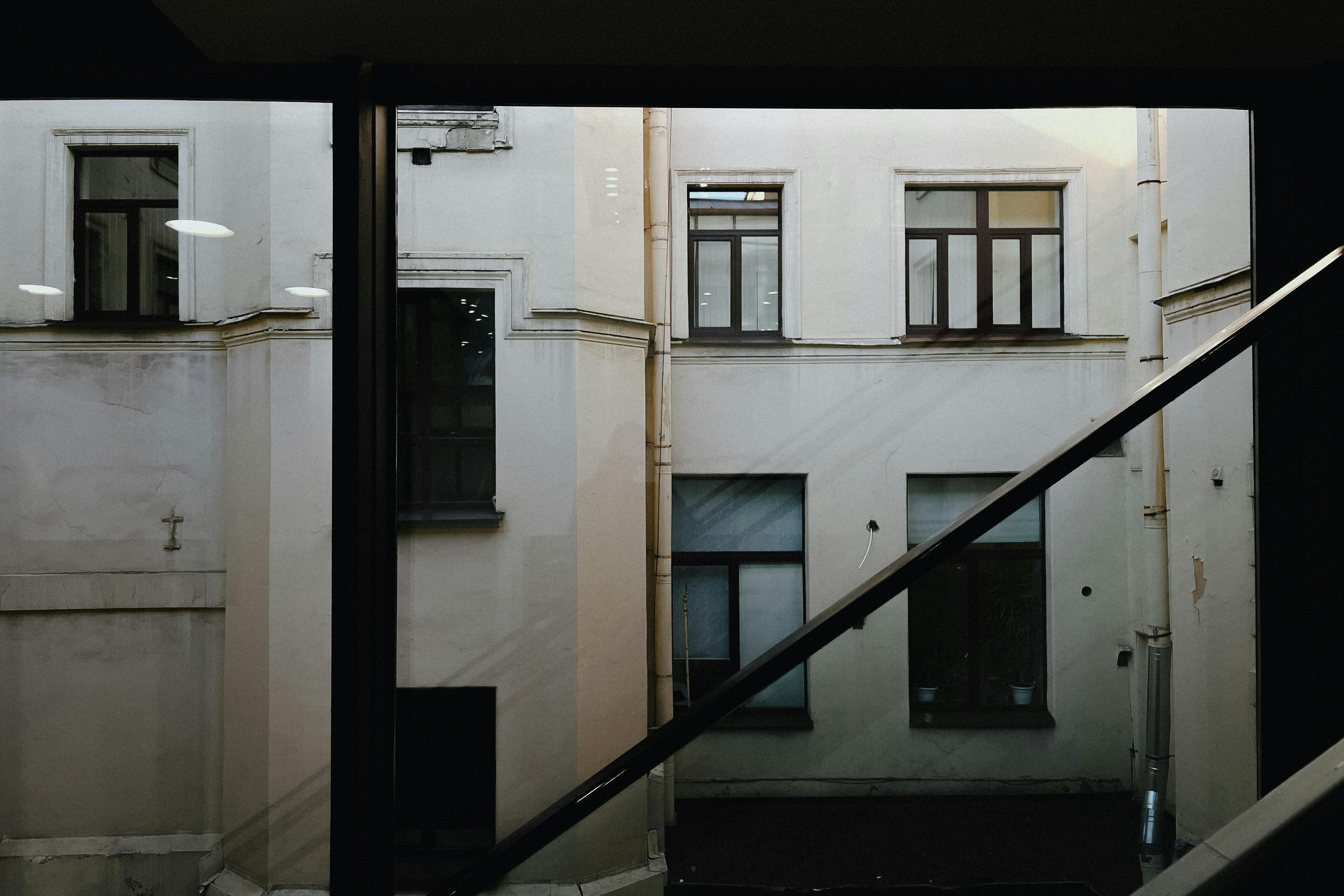 A view of a building through a window photo – Free Grey Image on Unsplash